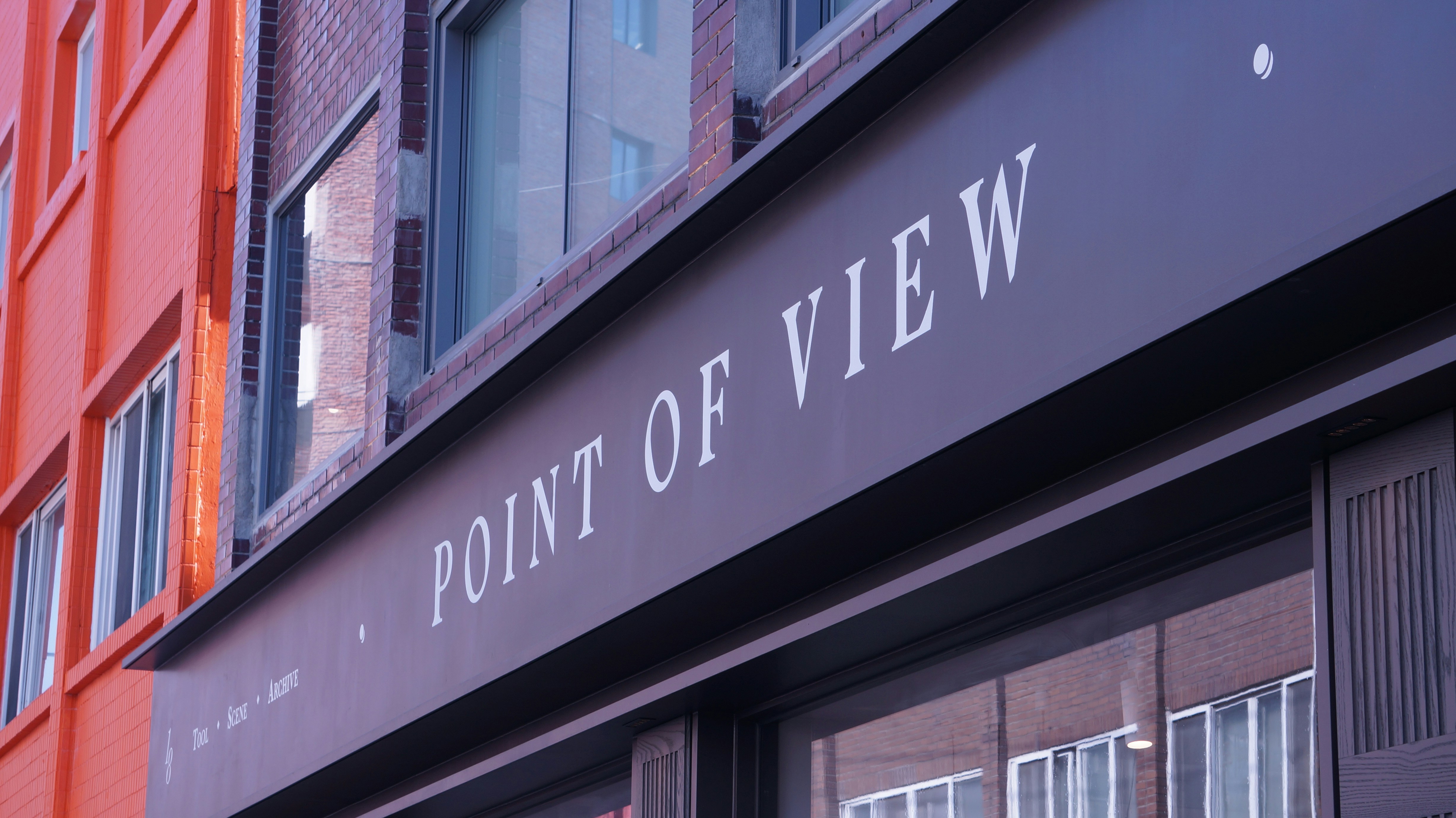 Point of view sign on a building facade.