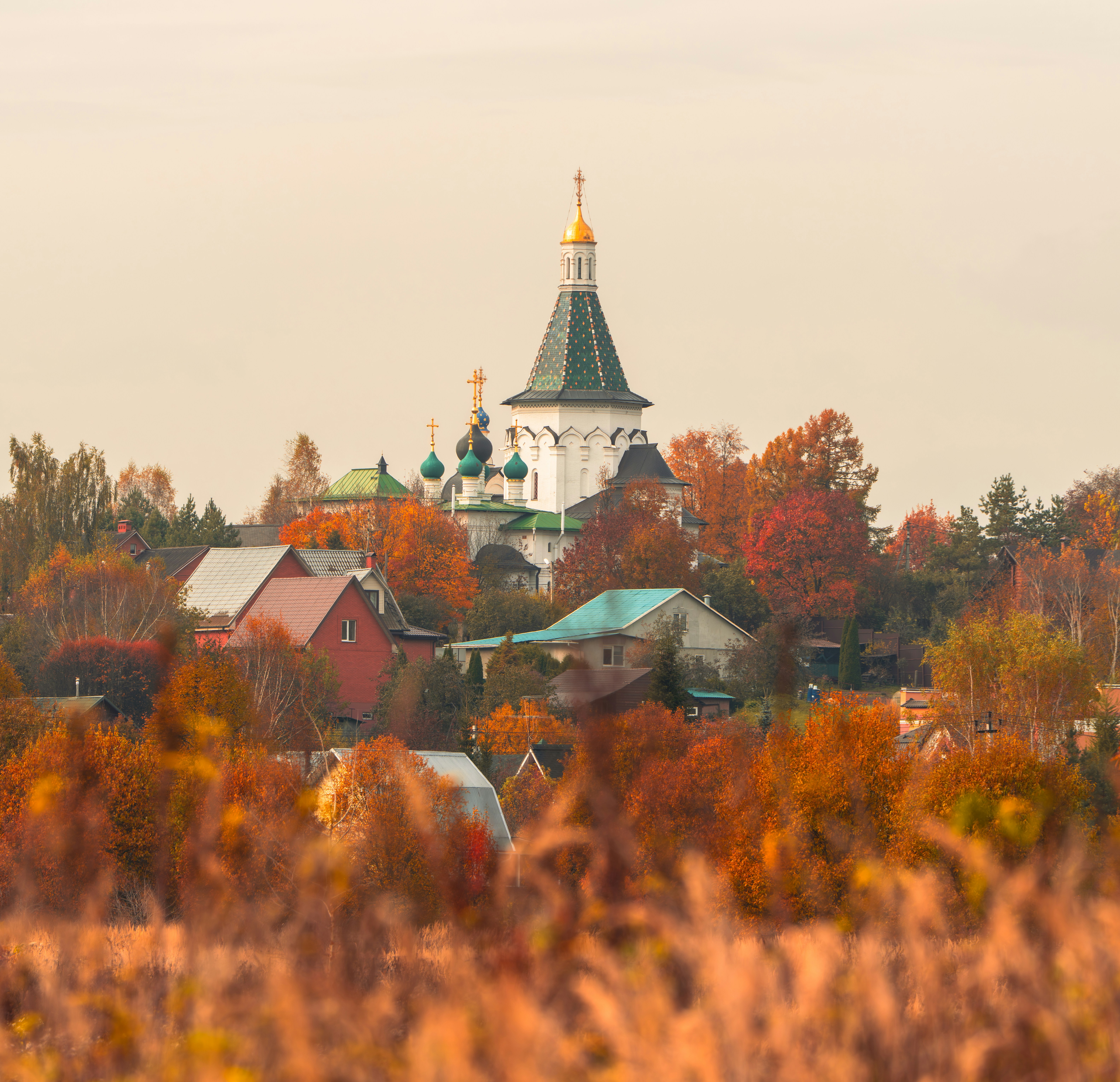 Amber Canopy over a Green-Topped Cathedral in Autumn Light