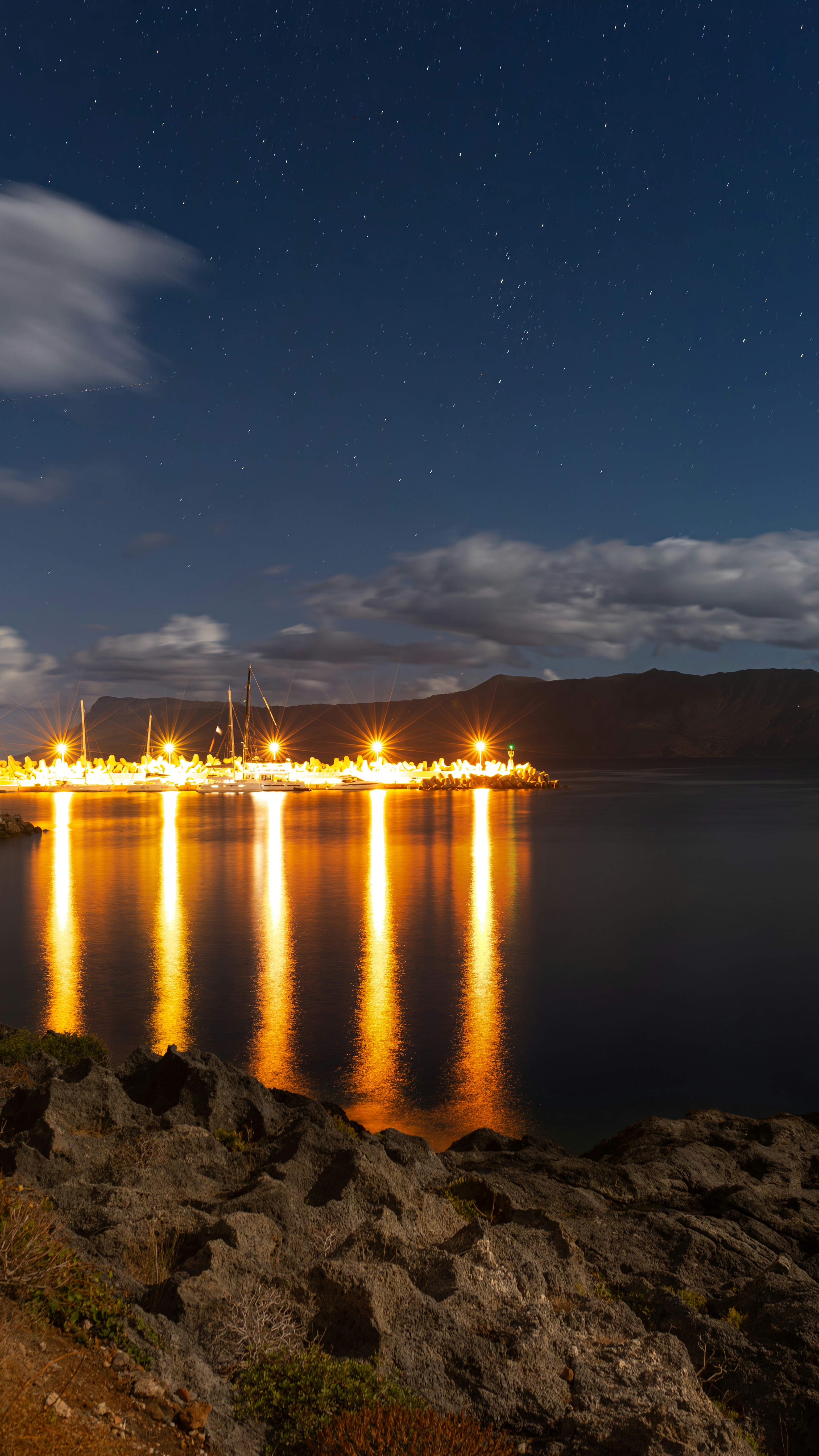 Luminous Reflections: A Harbor's Night Embrace