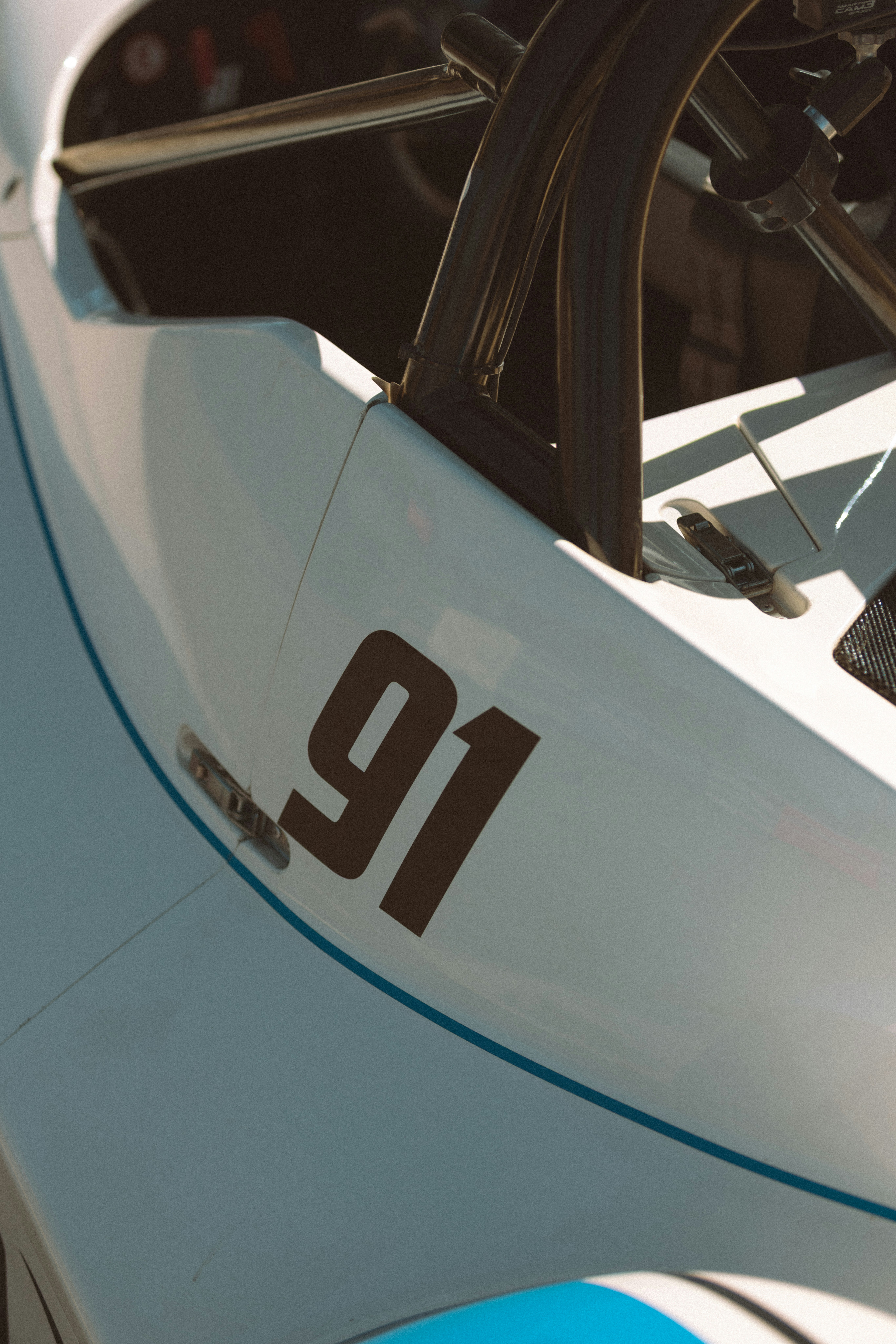 White race car with number 91
