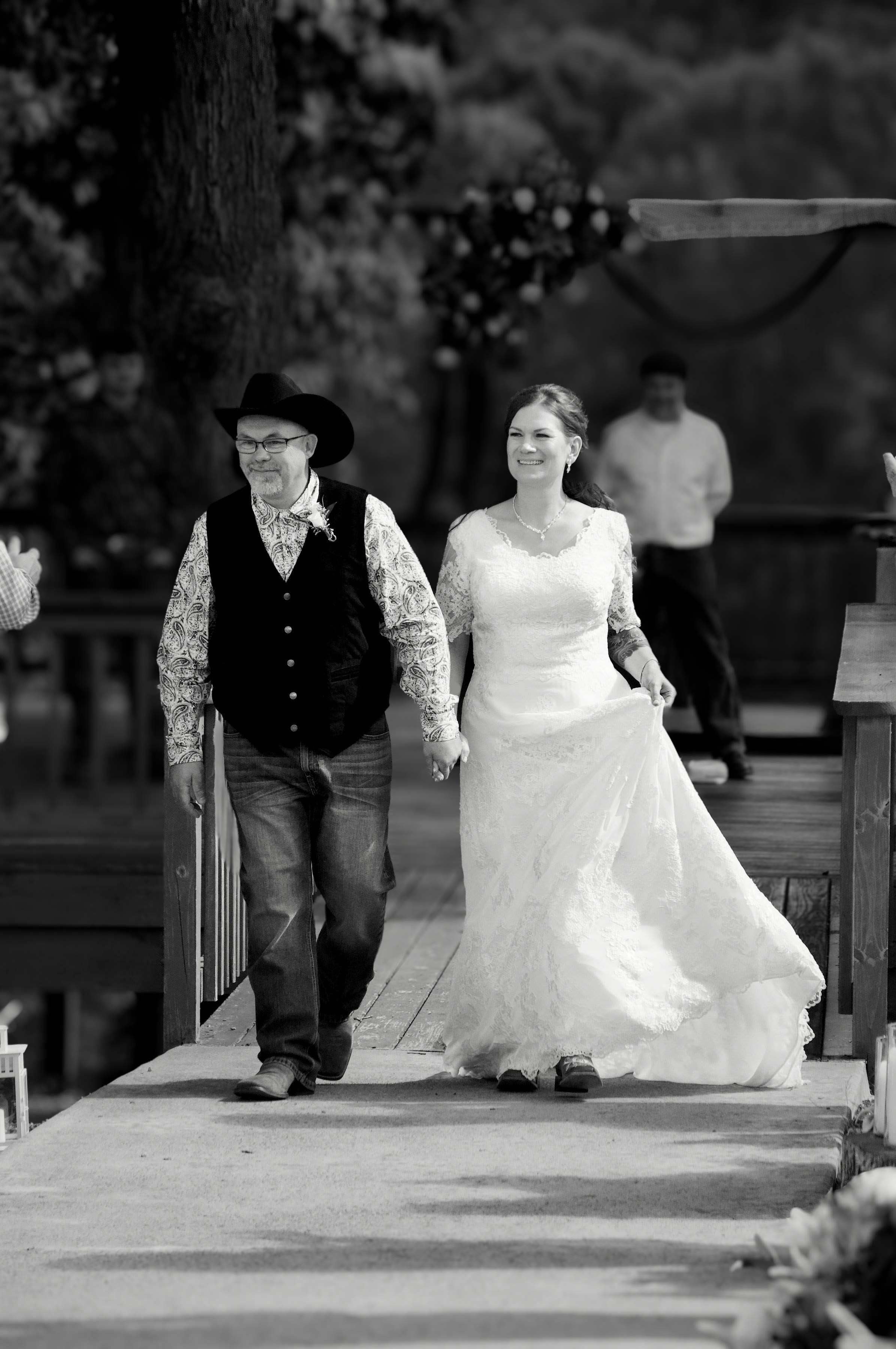 Bride and groom walk down aisle