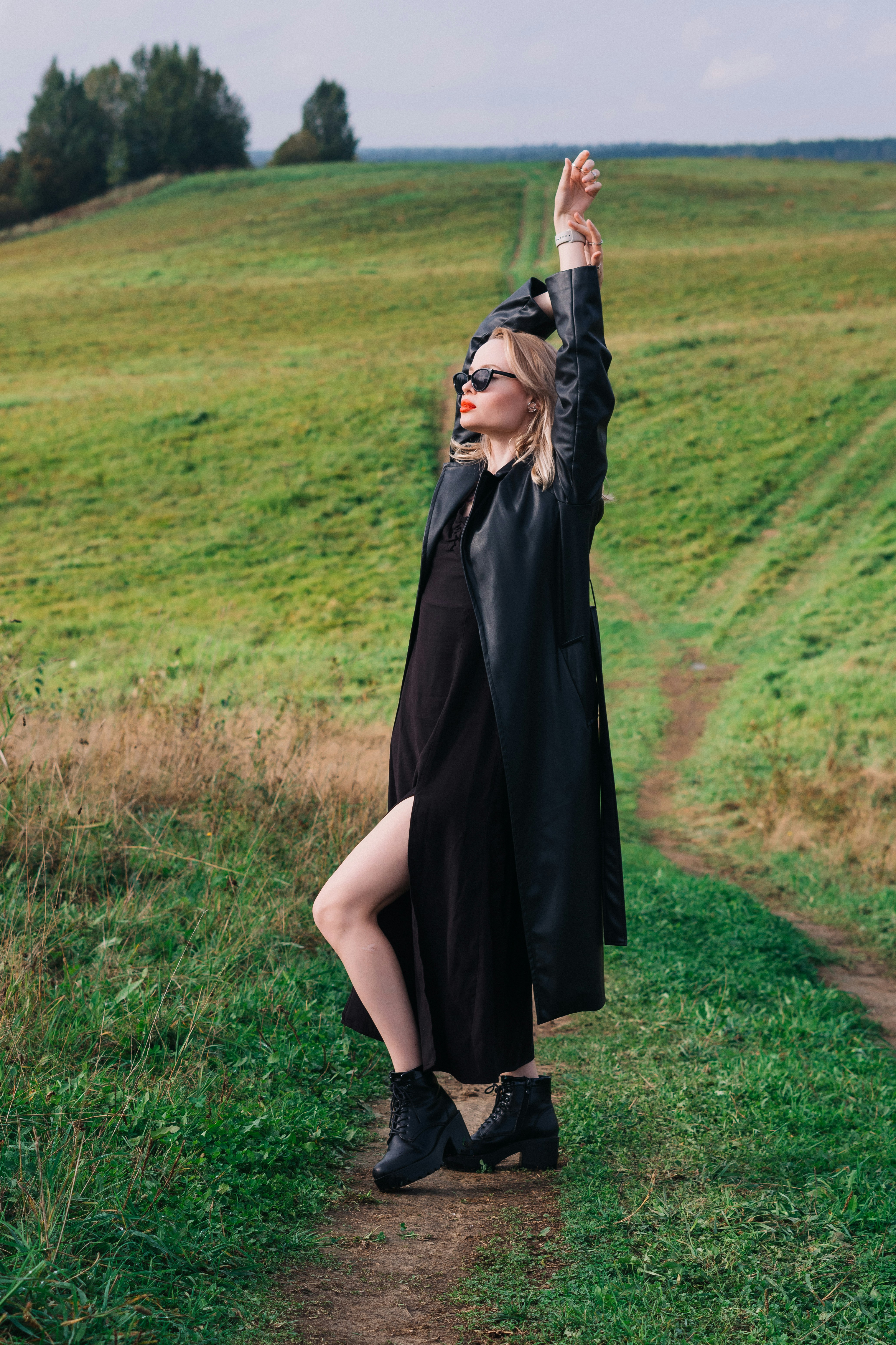 Leather on the Green Horizon: A Bold Pose on a Rolling Meadow
