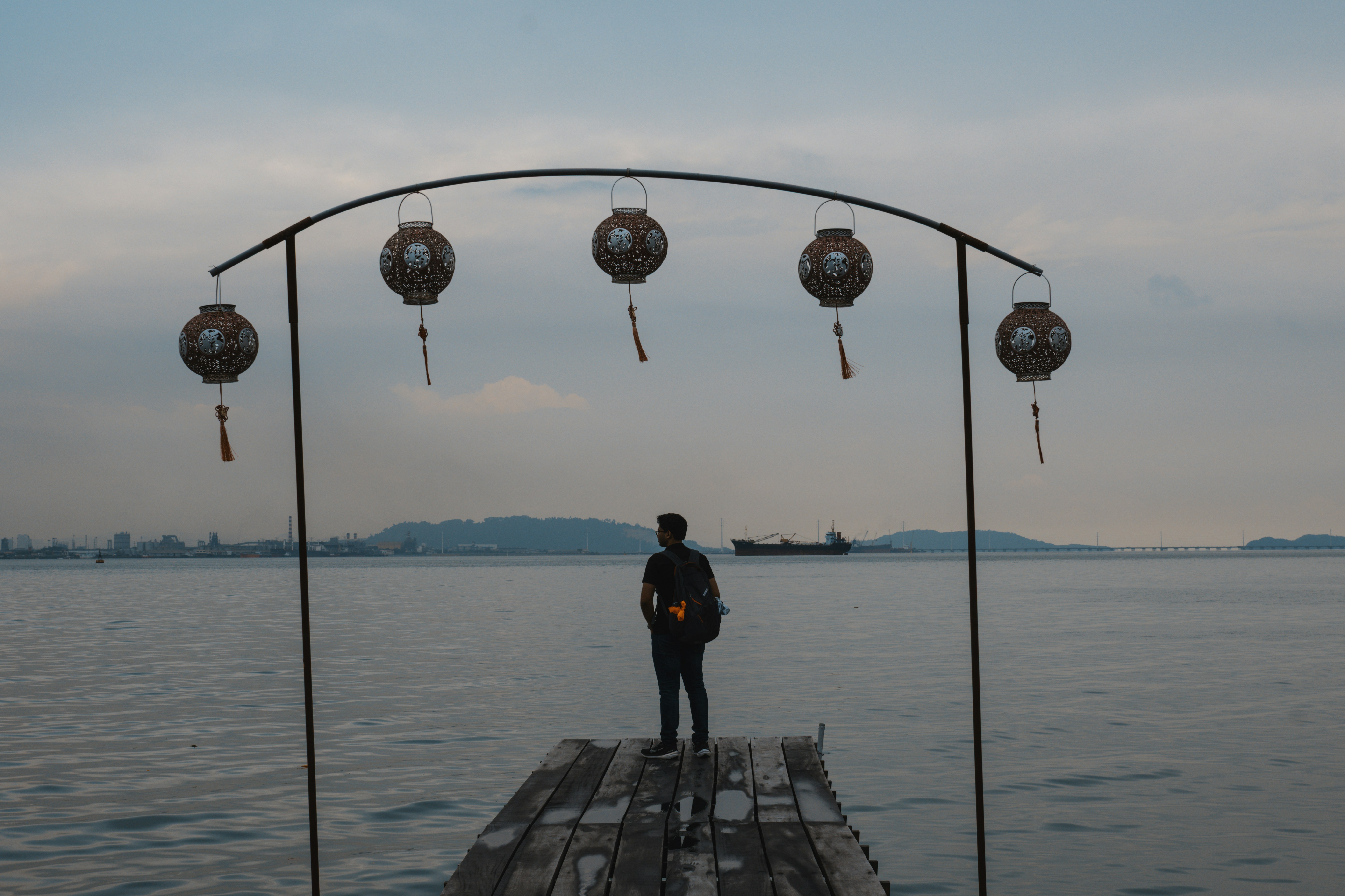Lantern Arch and a Sole Figure: Quiet Promenade at Dusk