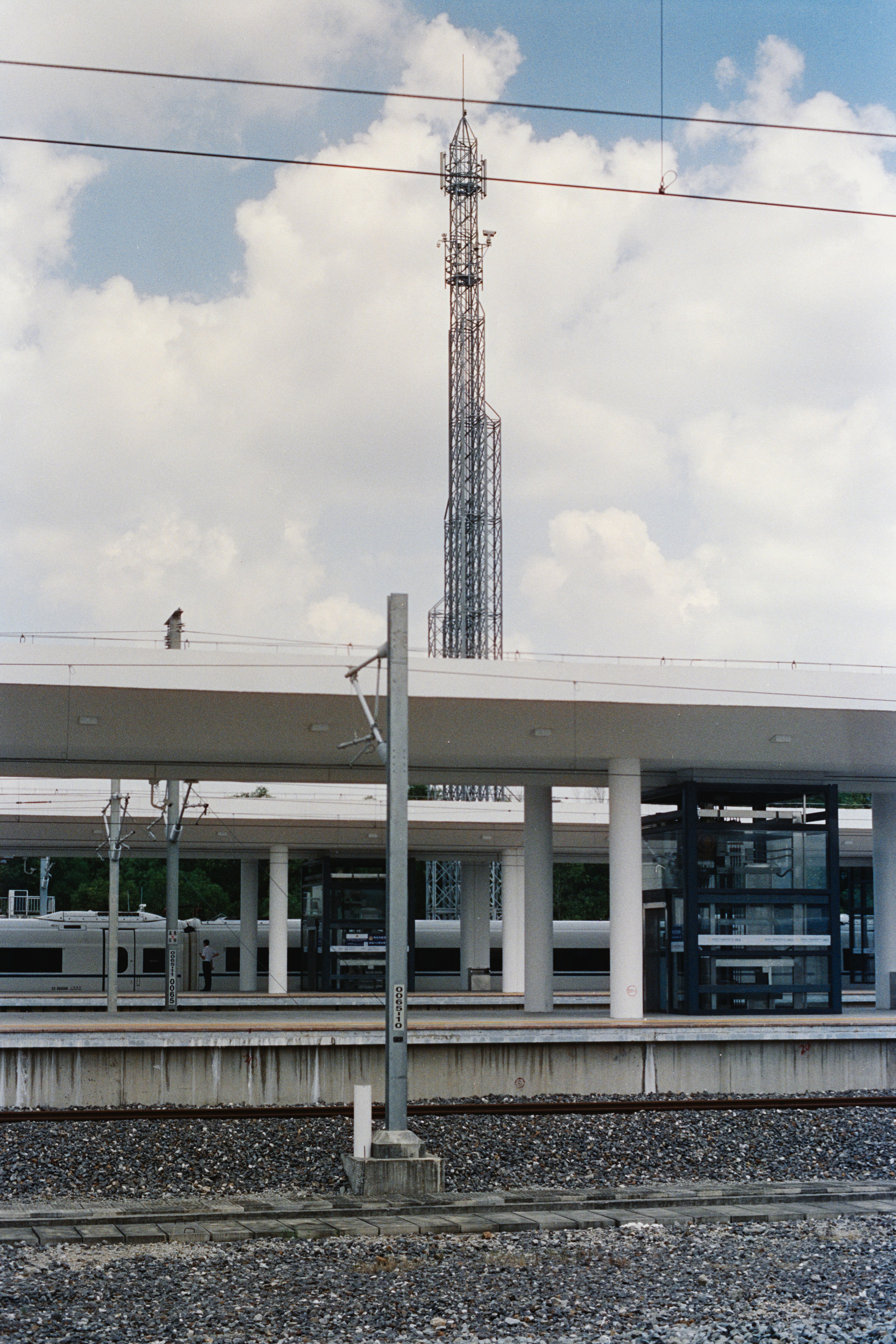 Tall cell tower above a modern train station platform. photo – Free ...