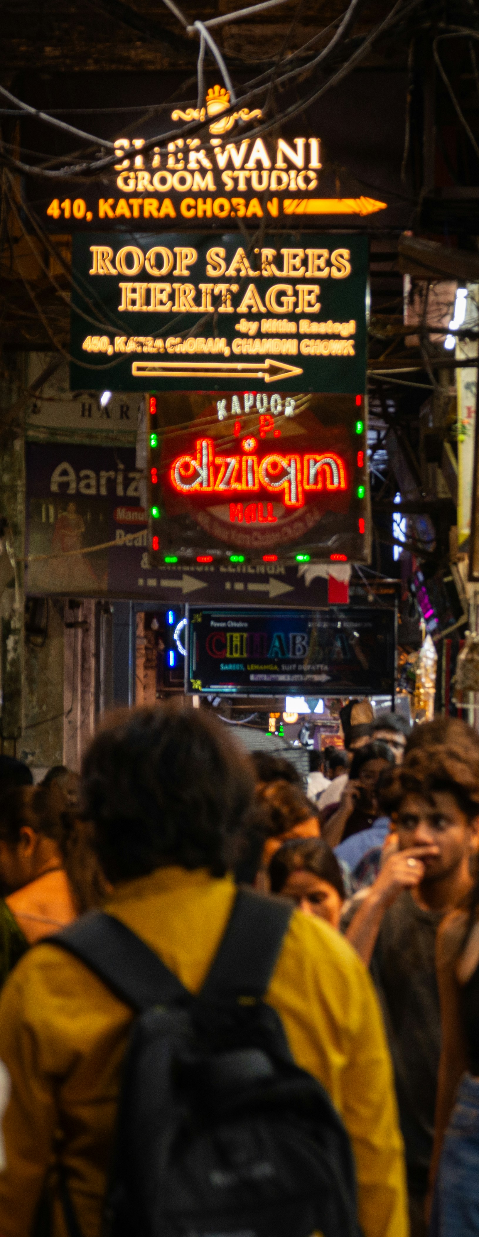Neon Alleyways: A Dense Corridor of Signage and People