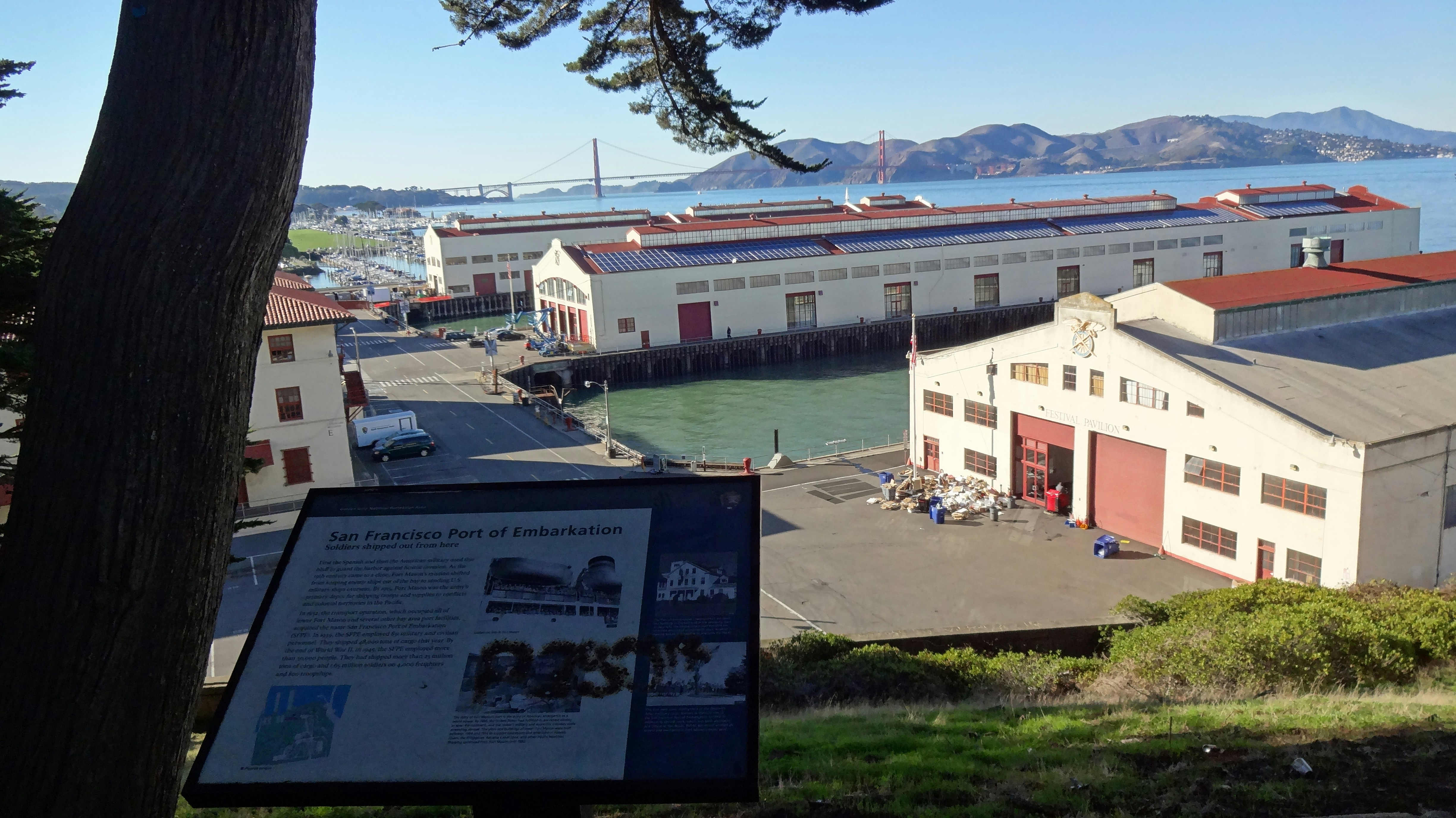 Buildings on a waterfront with a bridge in distance