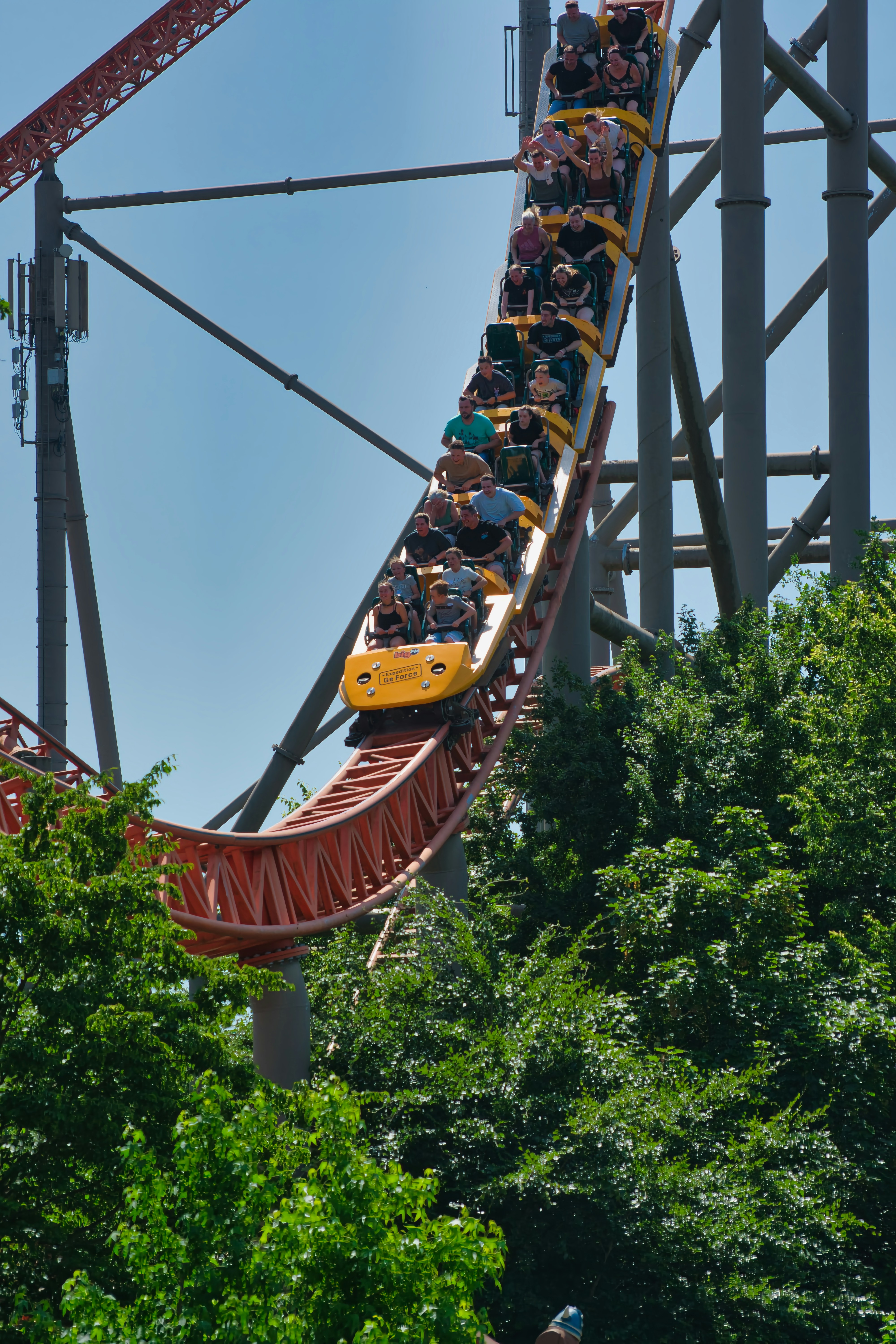 Expedition GeForce – the masterpiece of speed and airtime. This legendary Intamin megacoaster dominates the skyline with its towering first drop and relentless sequence of ejector airtime hills. Known for its smooth yet powerful pacing, Expedition GeForce remains one of Europe’s most iconic roller coasters, delivering a near-perfect blend of intensity and elegance. 🎢 Ride Facts: Type: Steel Megacoaster (Intamin AG) Opened: 18 June 2001 Height: 53 m Length: 1,220 m Top Speed: 120 km/h Inversions: 0 Airtime Moments: 7+ Duration: ~1:15 min Trains: 2 trains, 7 cars each (2 riders per row) Theme | Roller coaster with riders descending a steep drop.