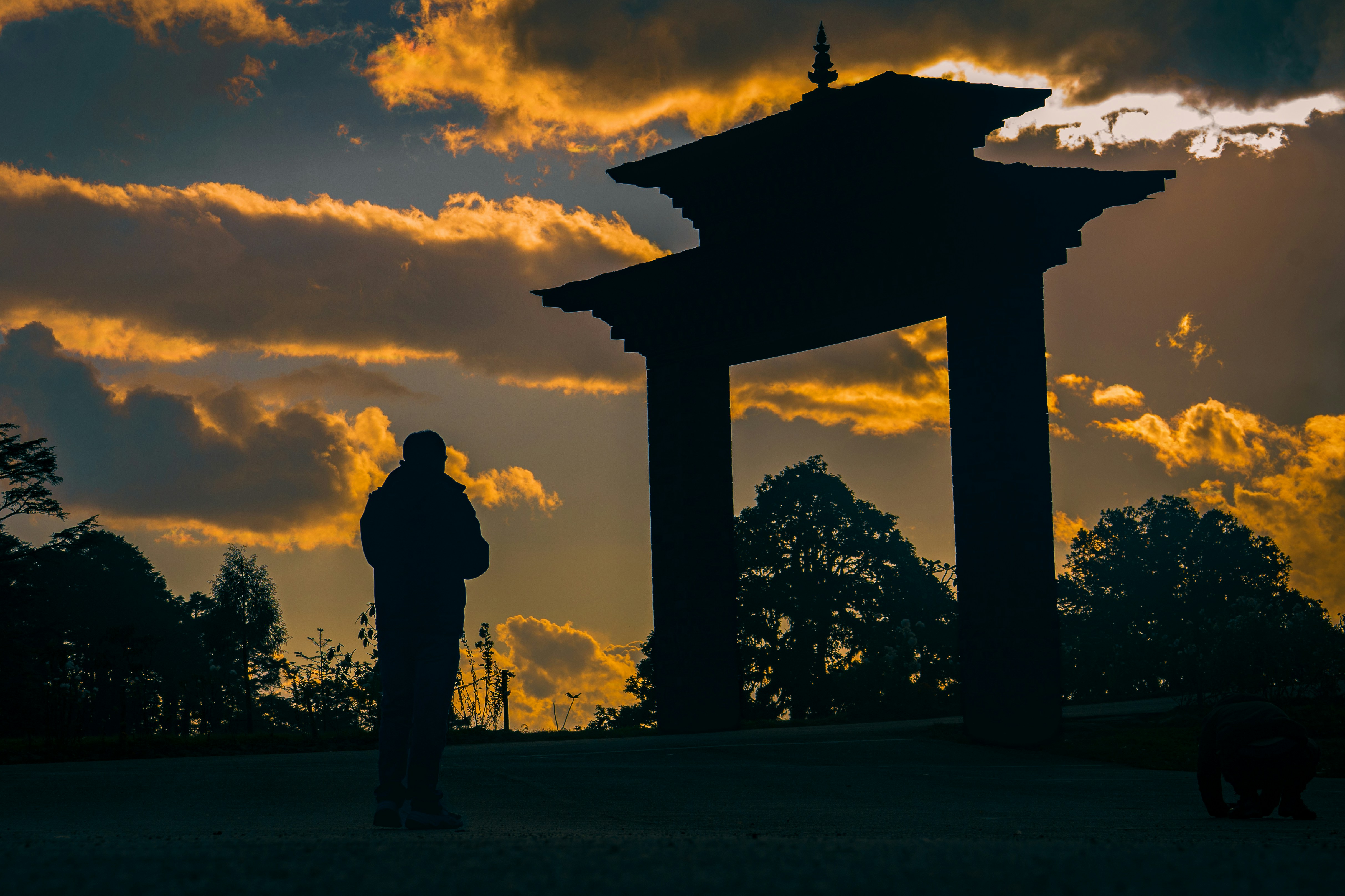 Silhouette at the Gate: A Quiet Dusk Portrait