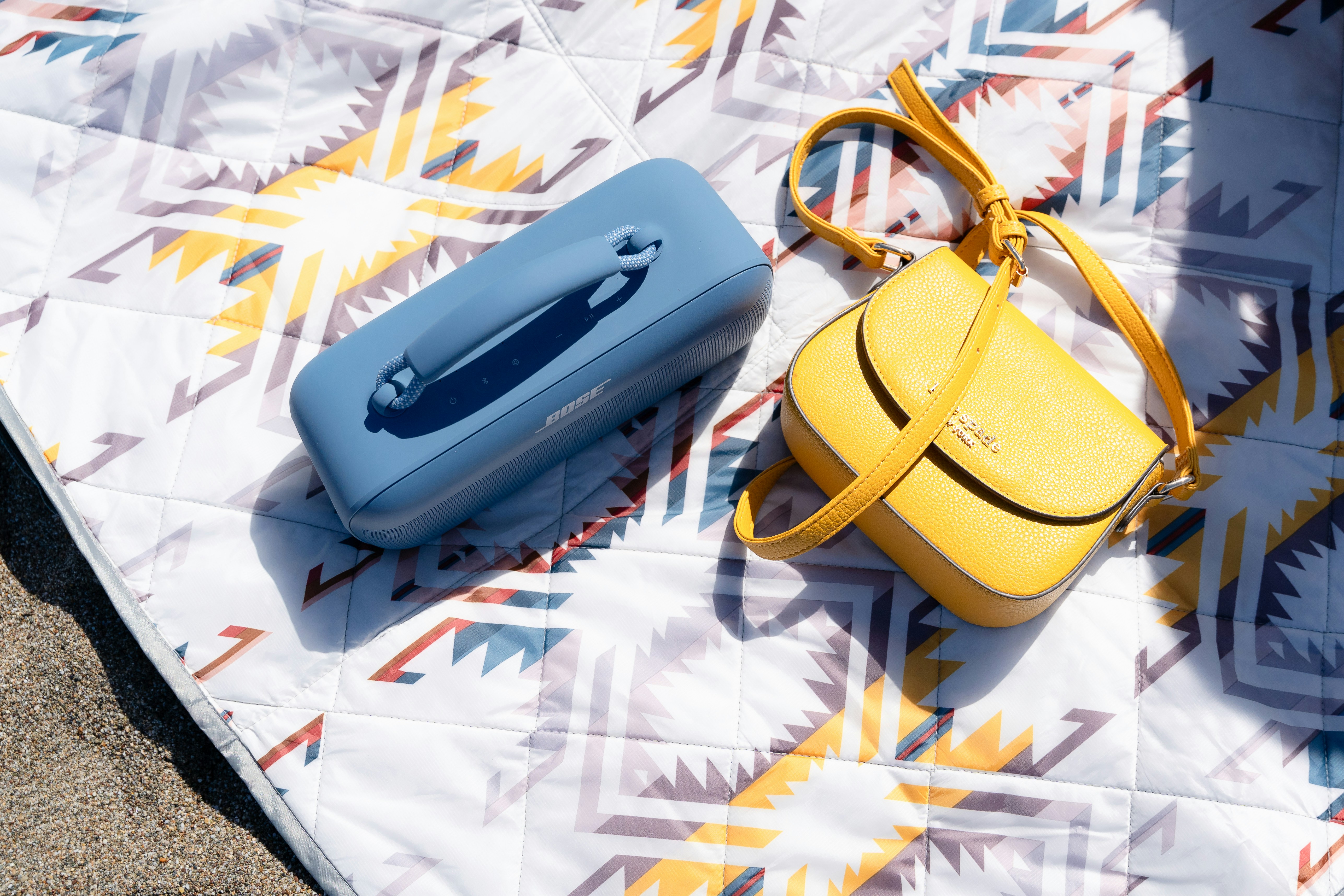 Chill!, 2024 | Two bags on a patterned blanket.