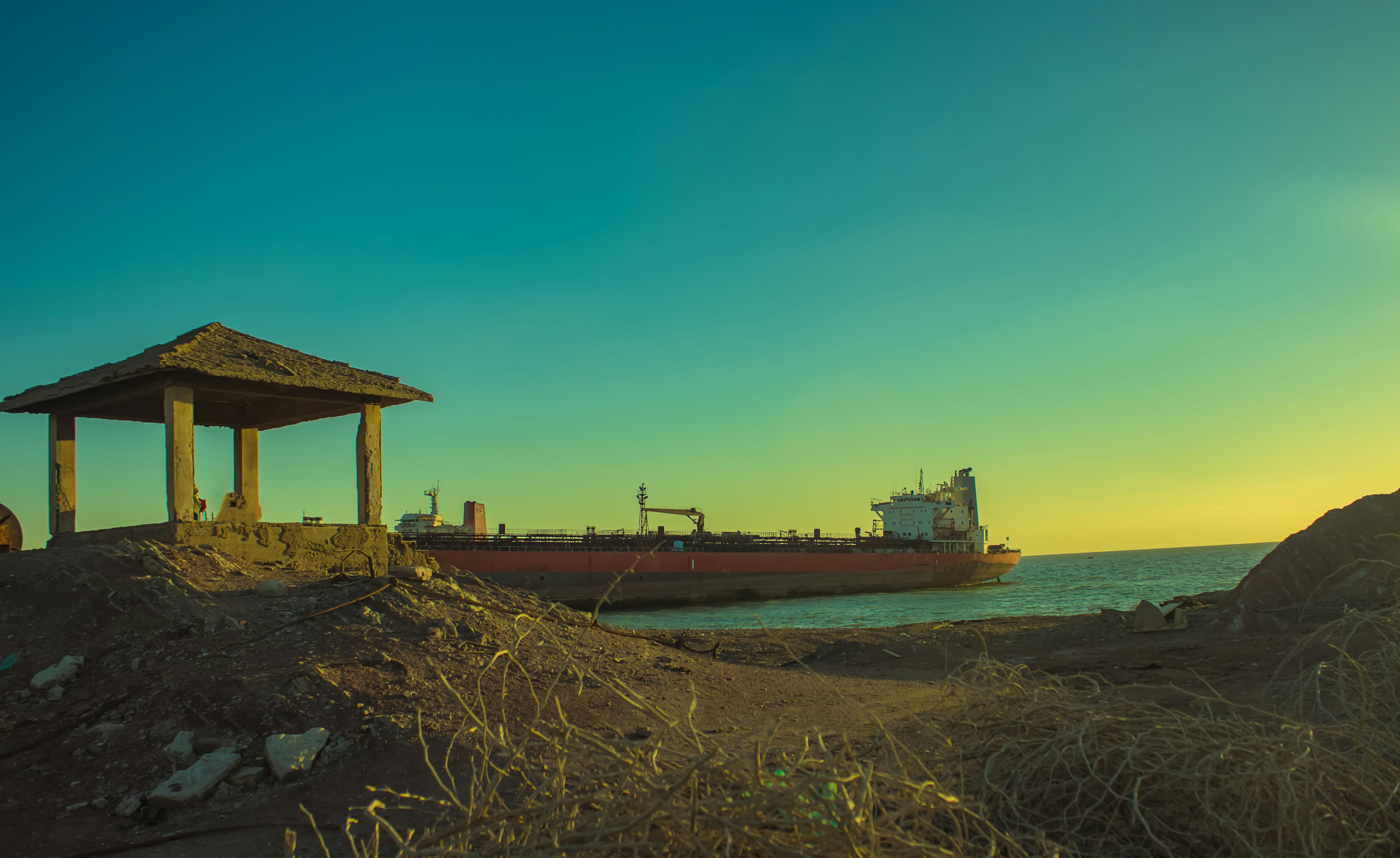 The Silent Sentinel: A Ship's Journey at Dusk
