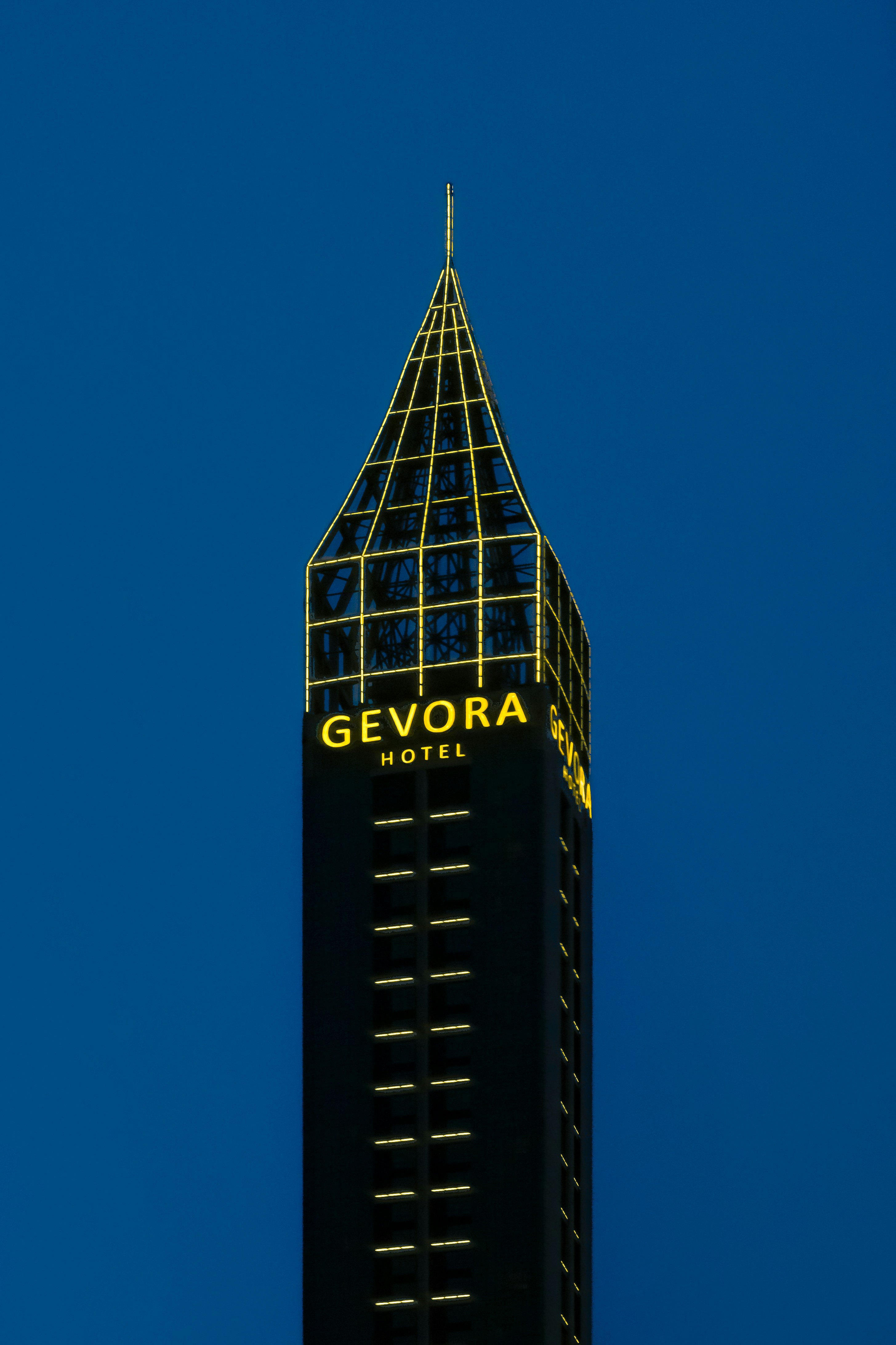 Gevora hotel skyscraper against a clear blue sky.
