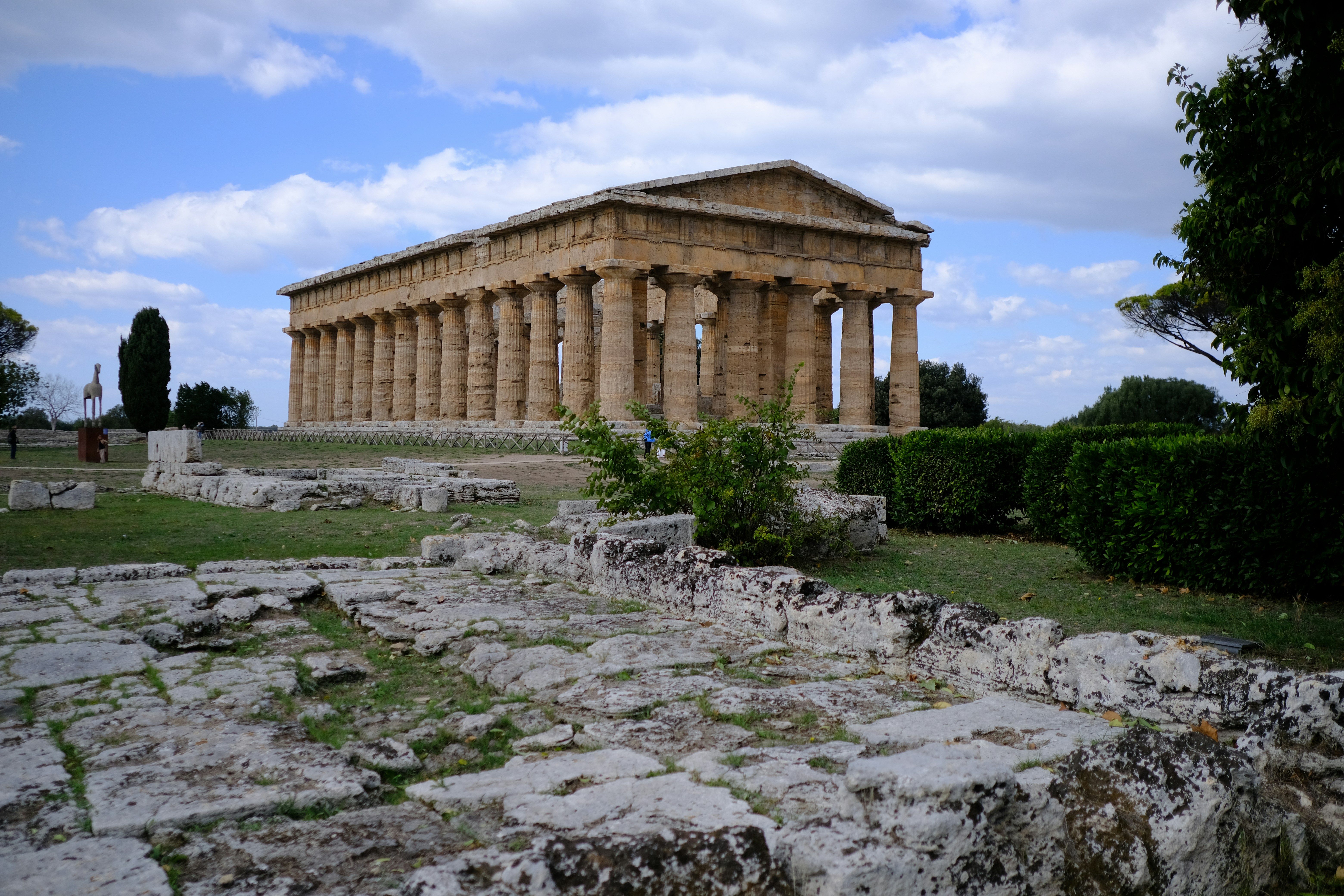 Paestum ruins | Ancient greek temple ruins under a cloudy sky
