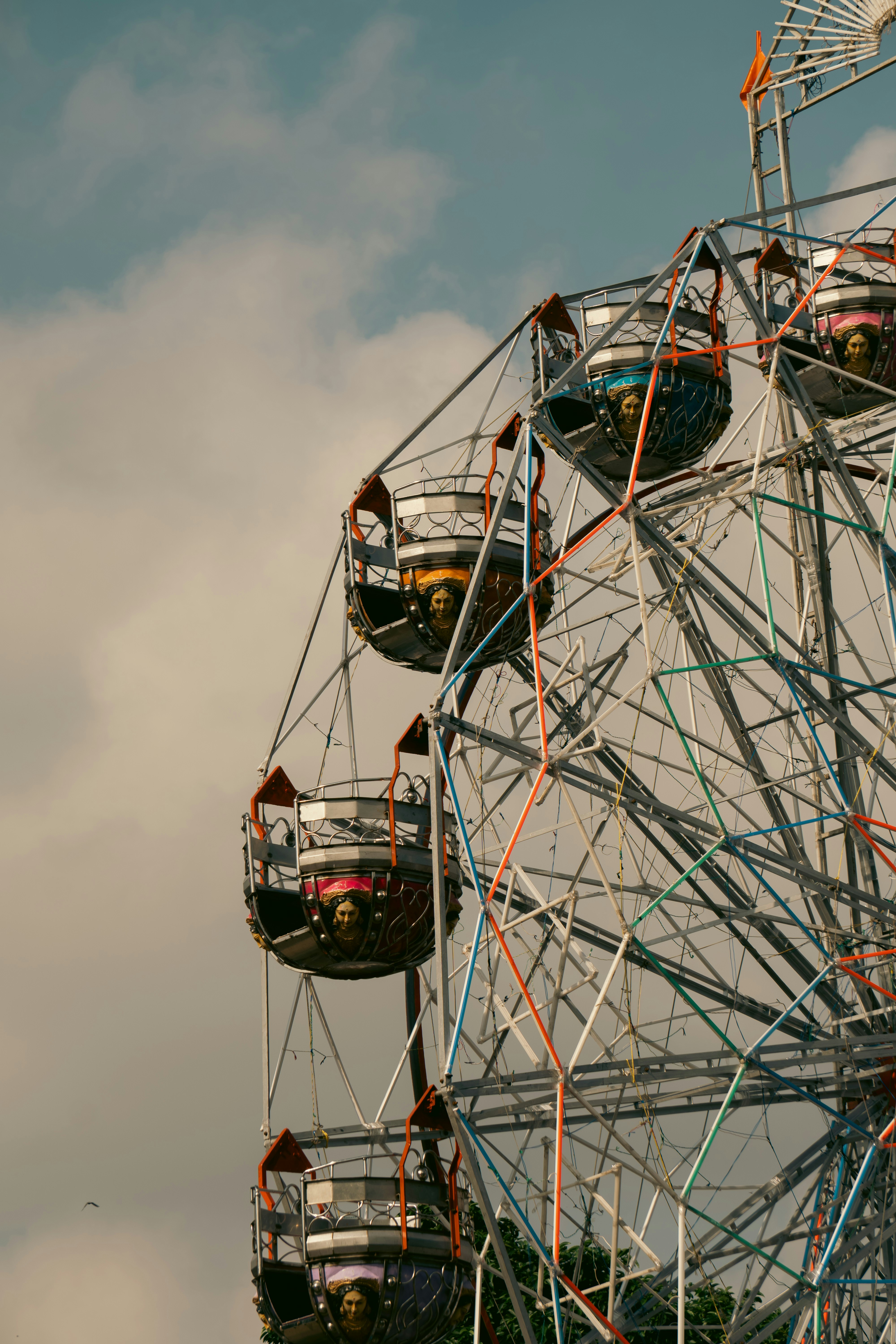 Spain without a | Close-up of a vintage ferris wheel against the sky