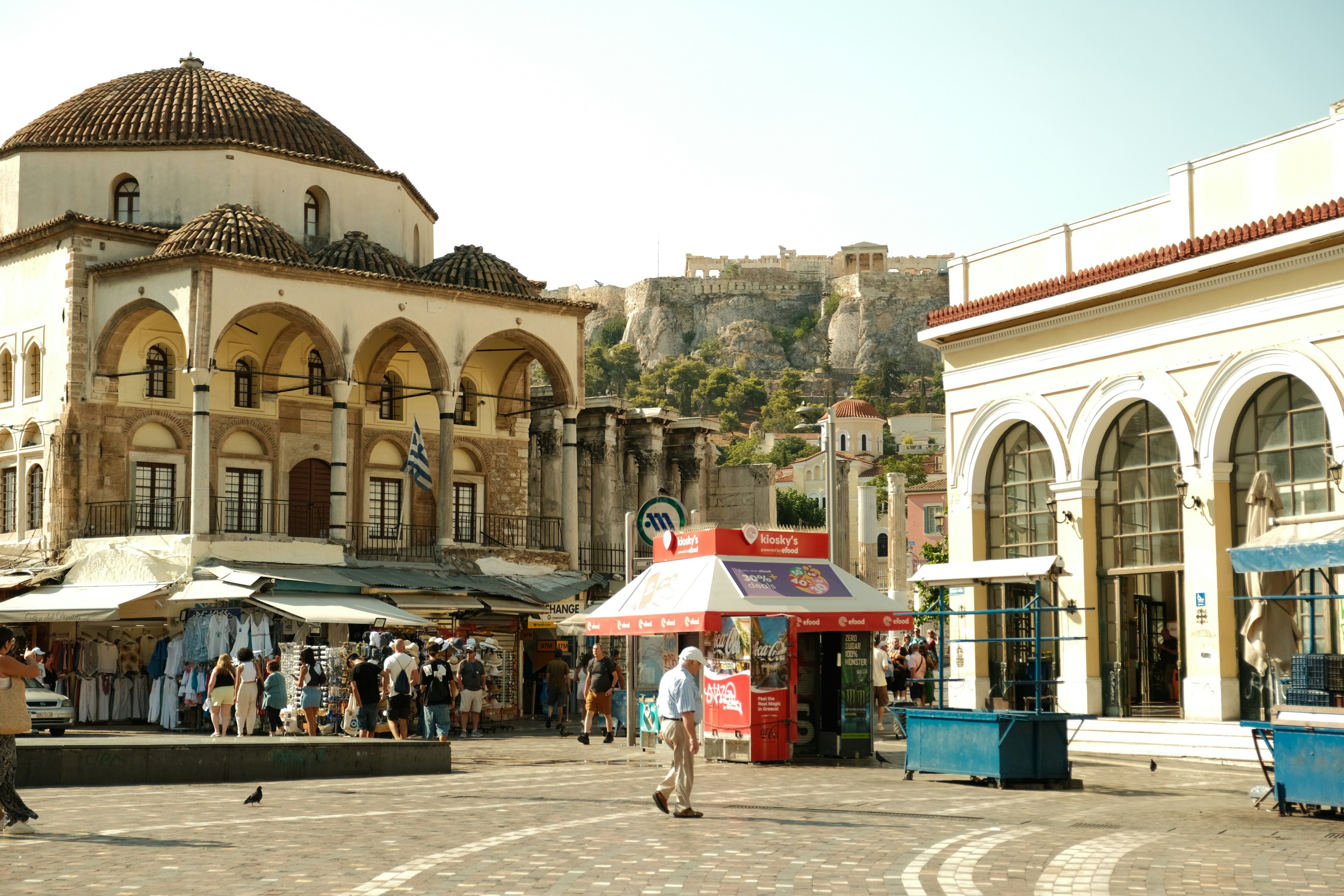 Summer in Athens | Historic square with ancient ruins in background.