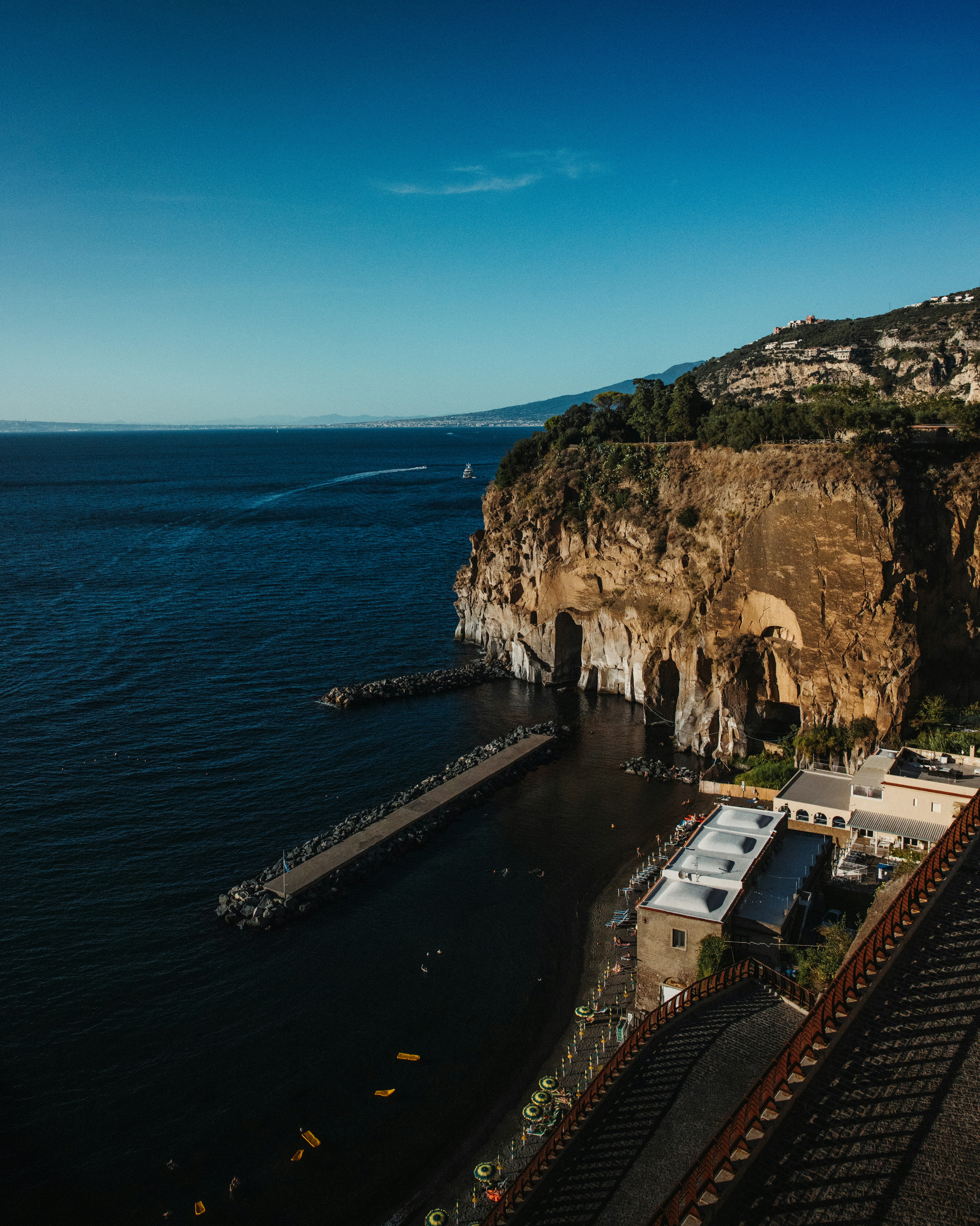 Cliffside Harbor: A Linear Dance of Sea, Stone, and Rail