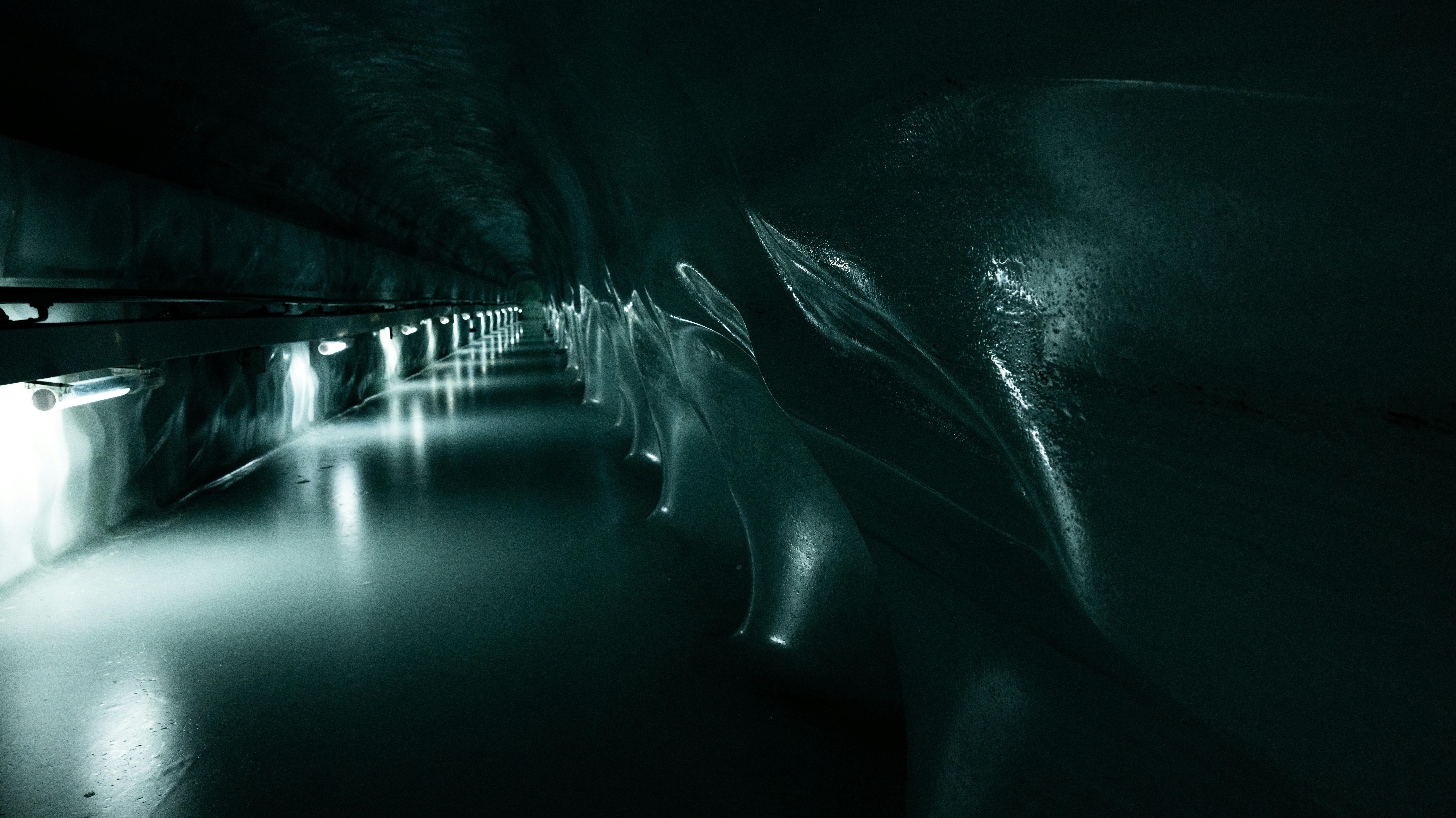 Abstract dark tunnel with glowing ice formations