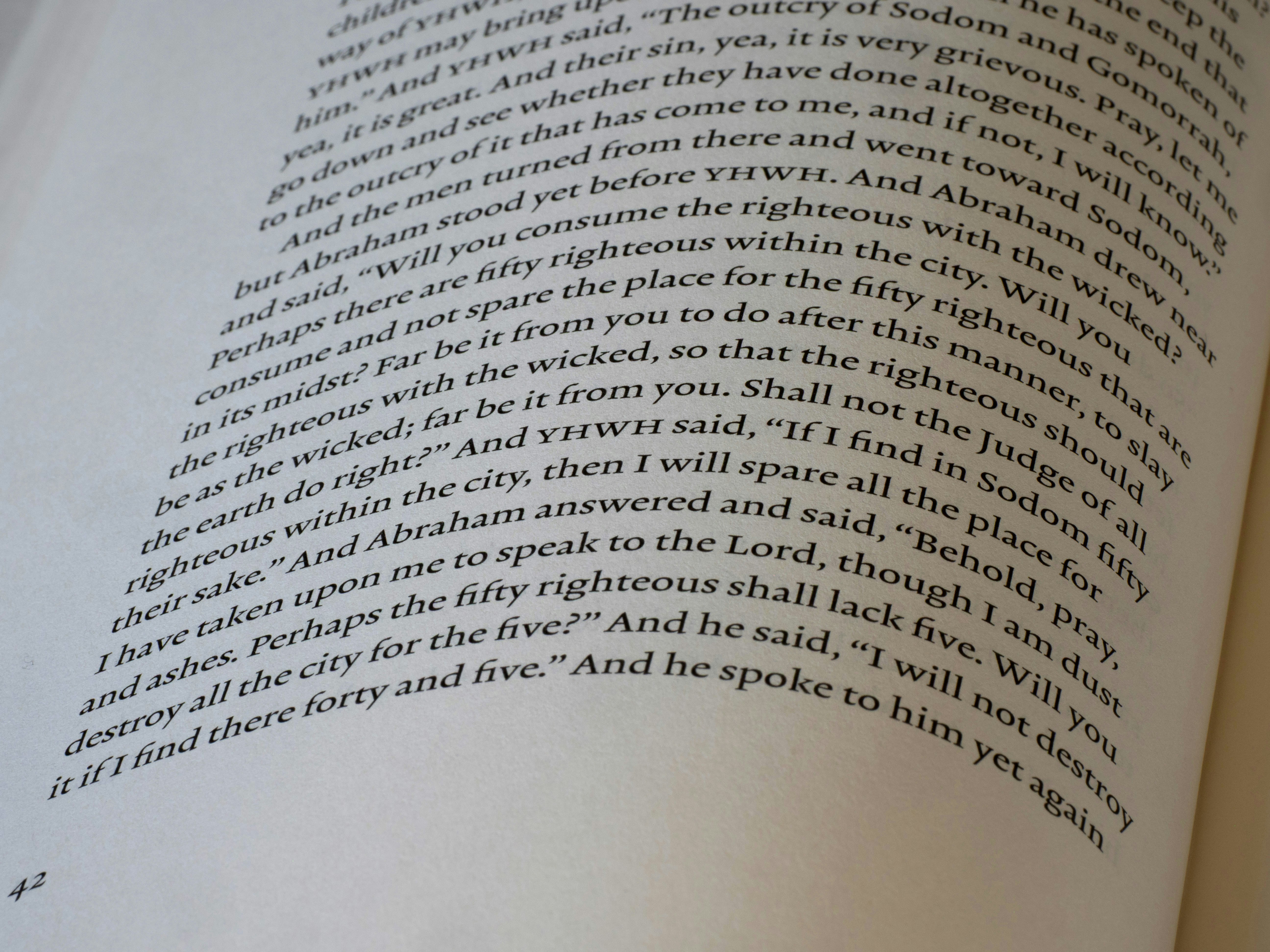 Text from a religious manuscript discussing the negotiation for the fate of Sodom, highlighting themes of justice and mercy.