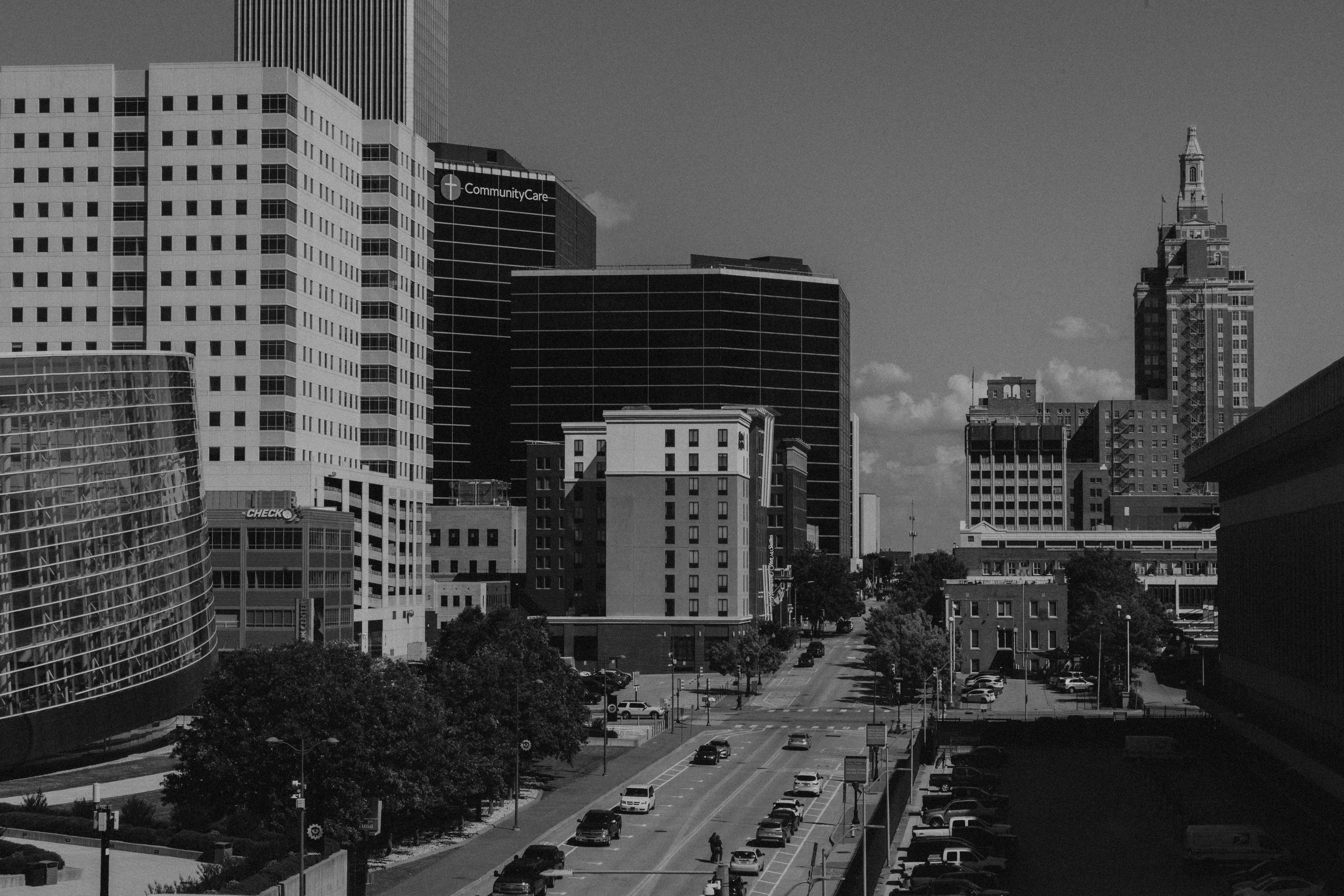 Cityscape with modern buildings and a busy street.