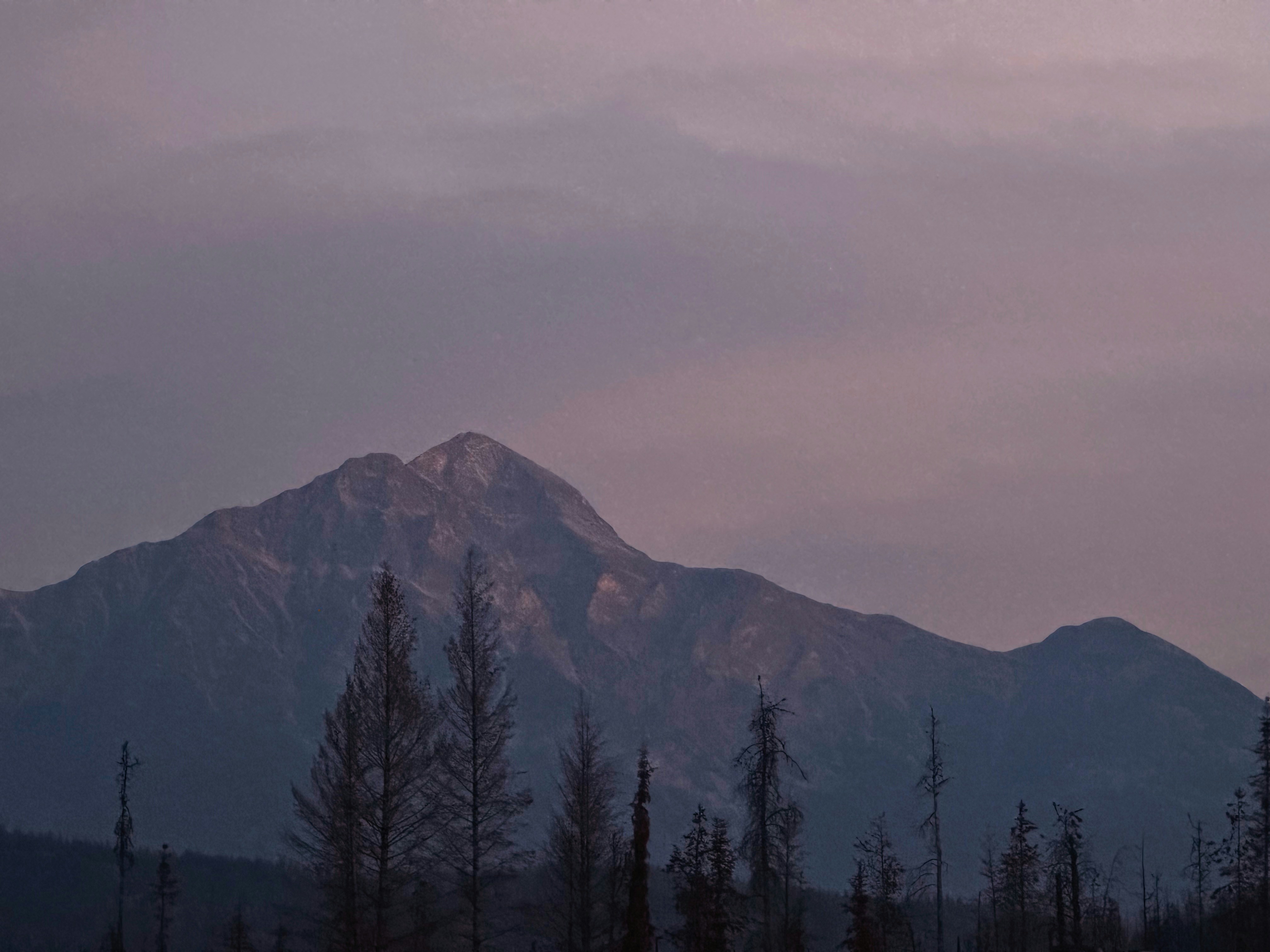 Majestic mountain peak under a dusky sky
