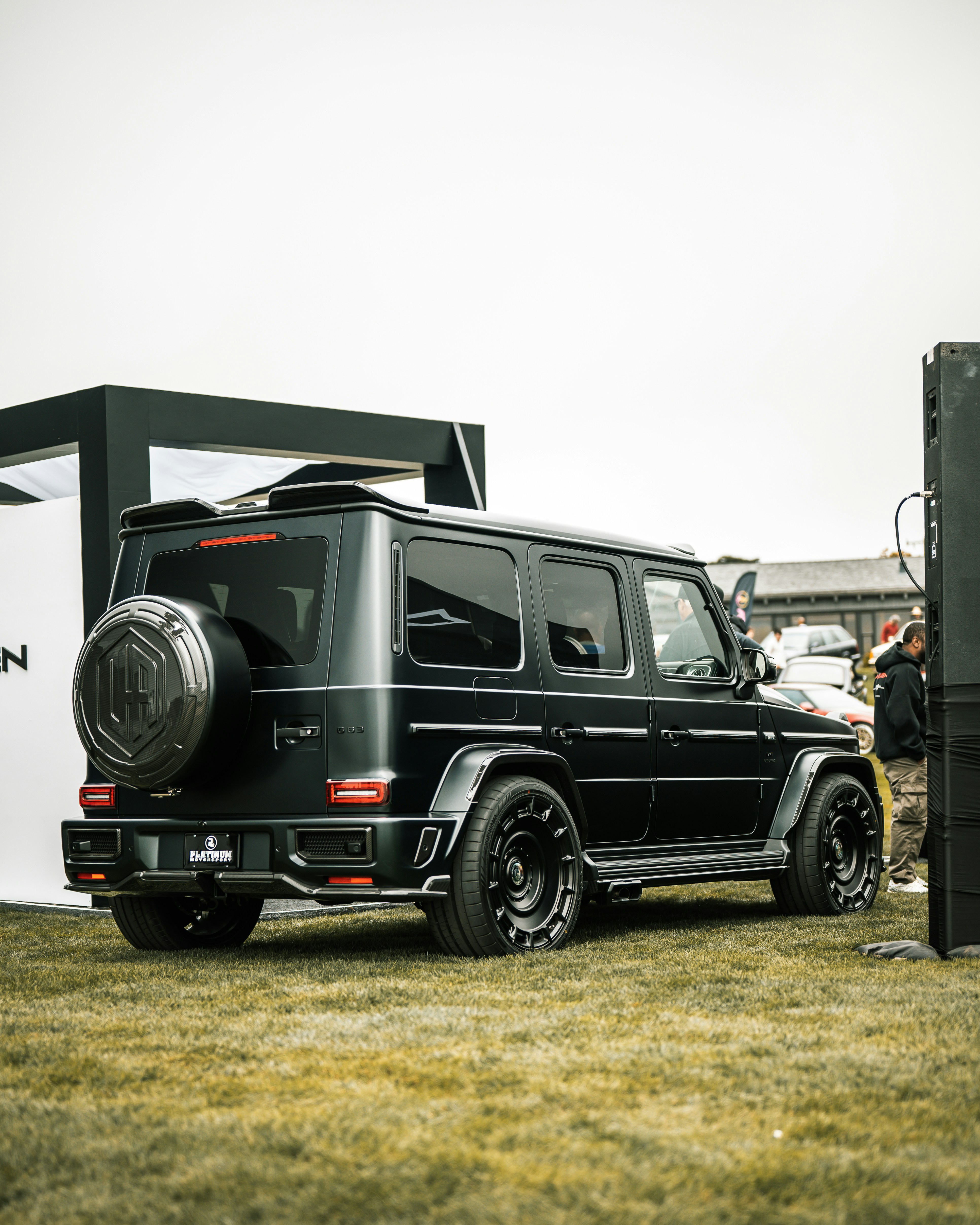 A black mercedes-benz g-wagon parked on grass photo – Free Cars Image ...