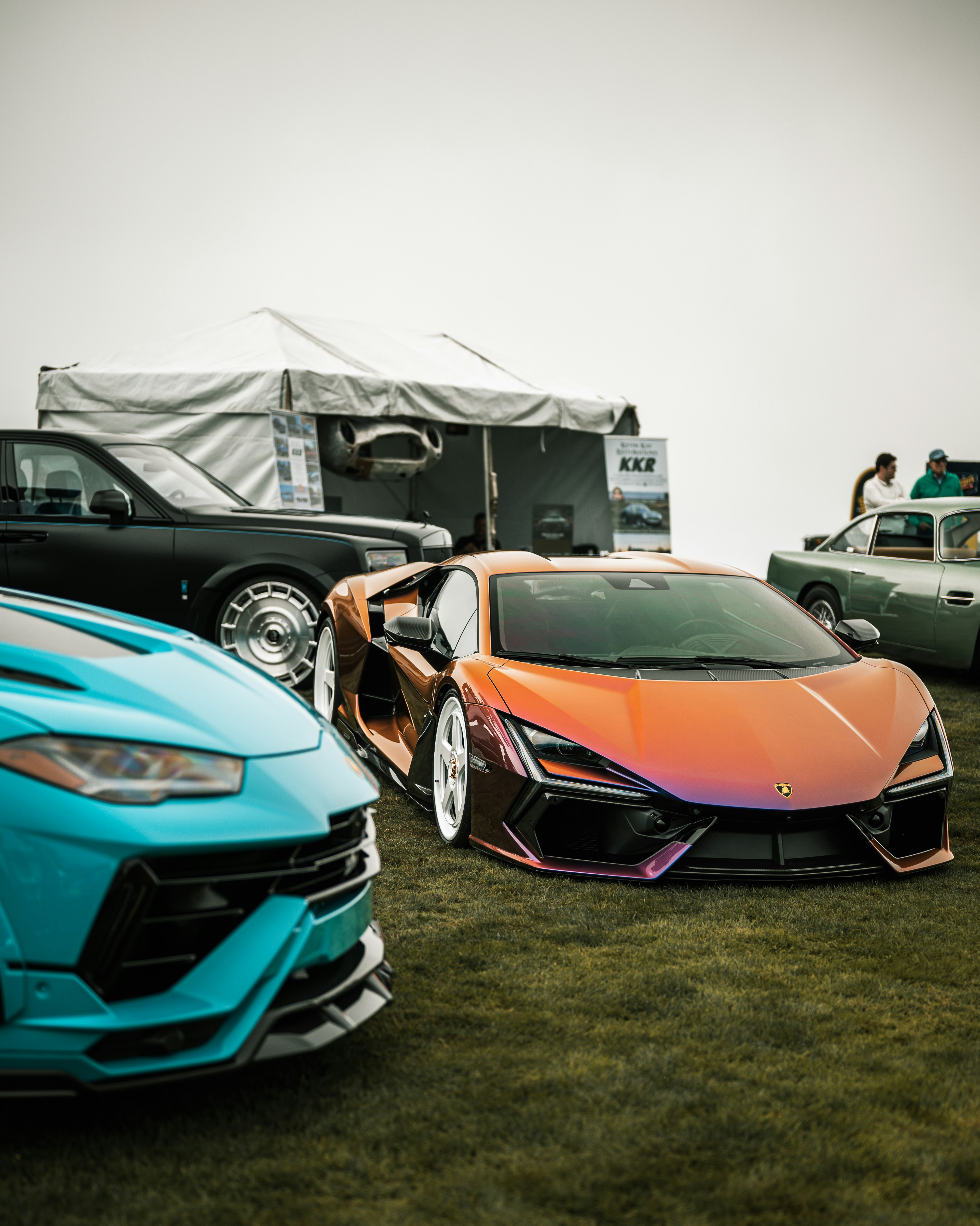 Fiery Orange Lamborghini Amid Chrome-Tinted Car Show Ambience
