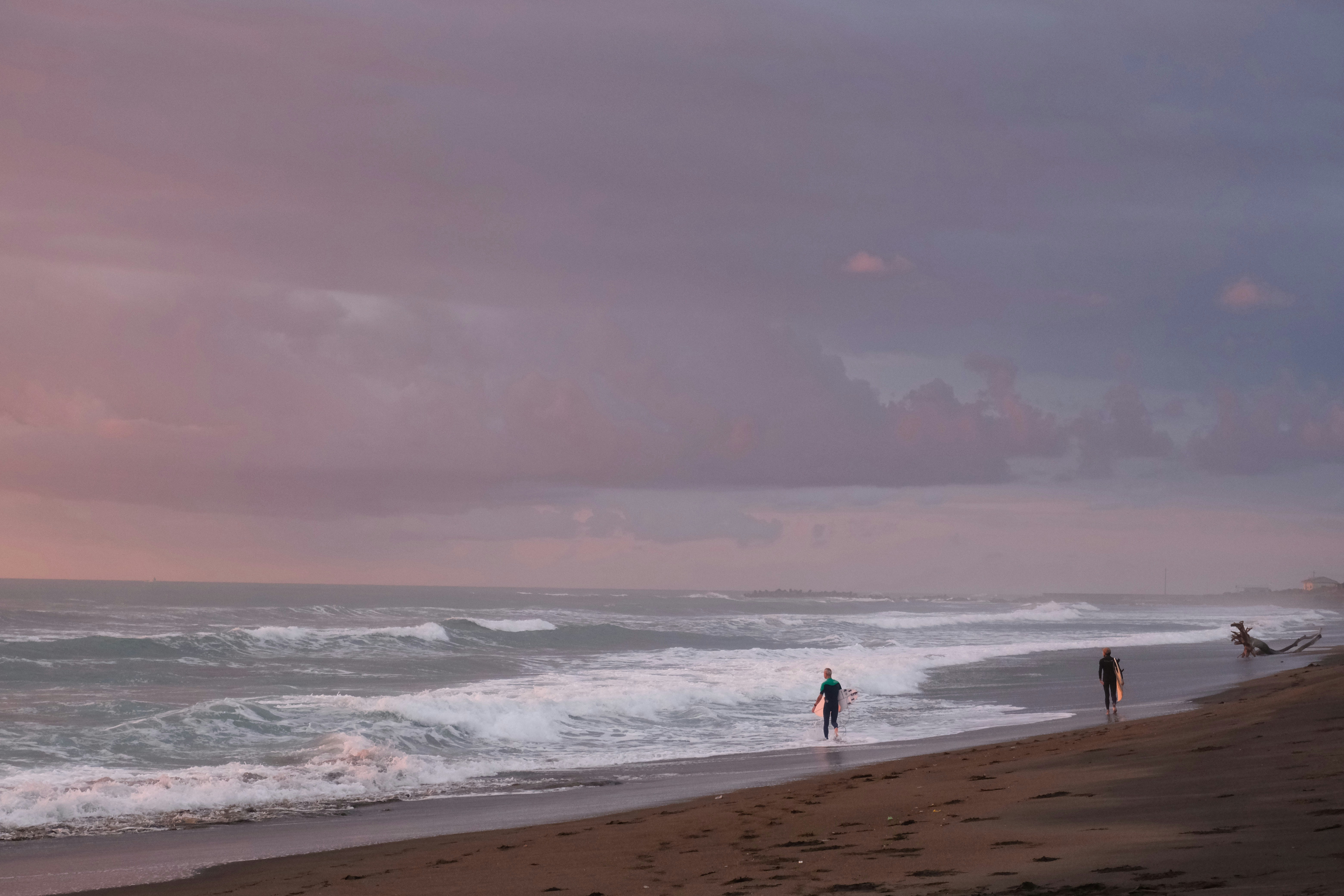 When in Chiba, Japan. | People walking on a beach at sunset