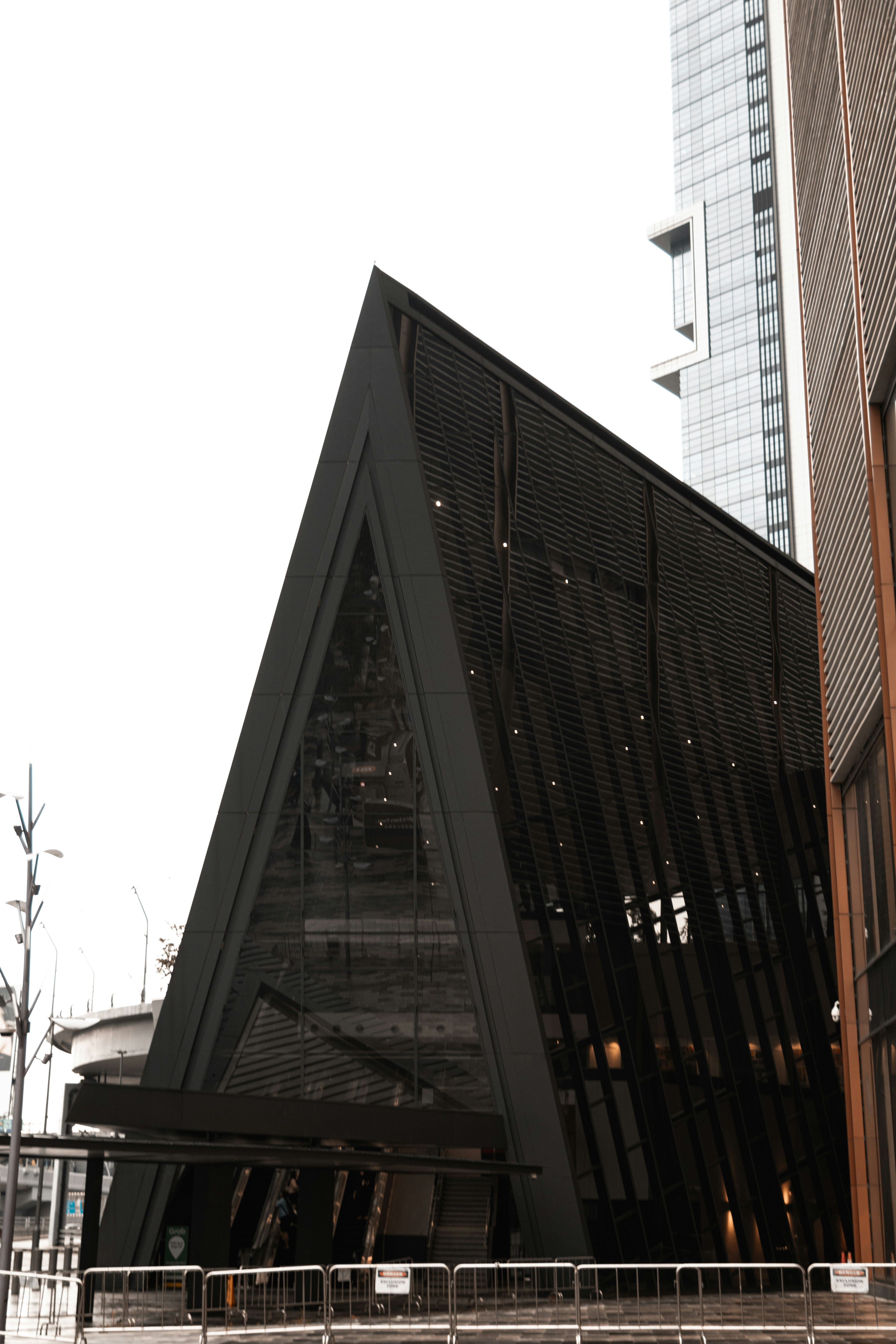 Modern triangular building with glass facade