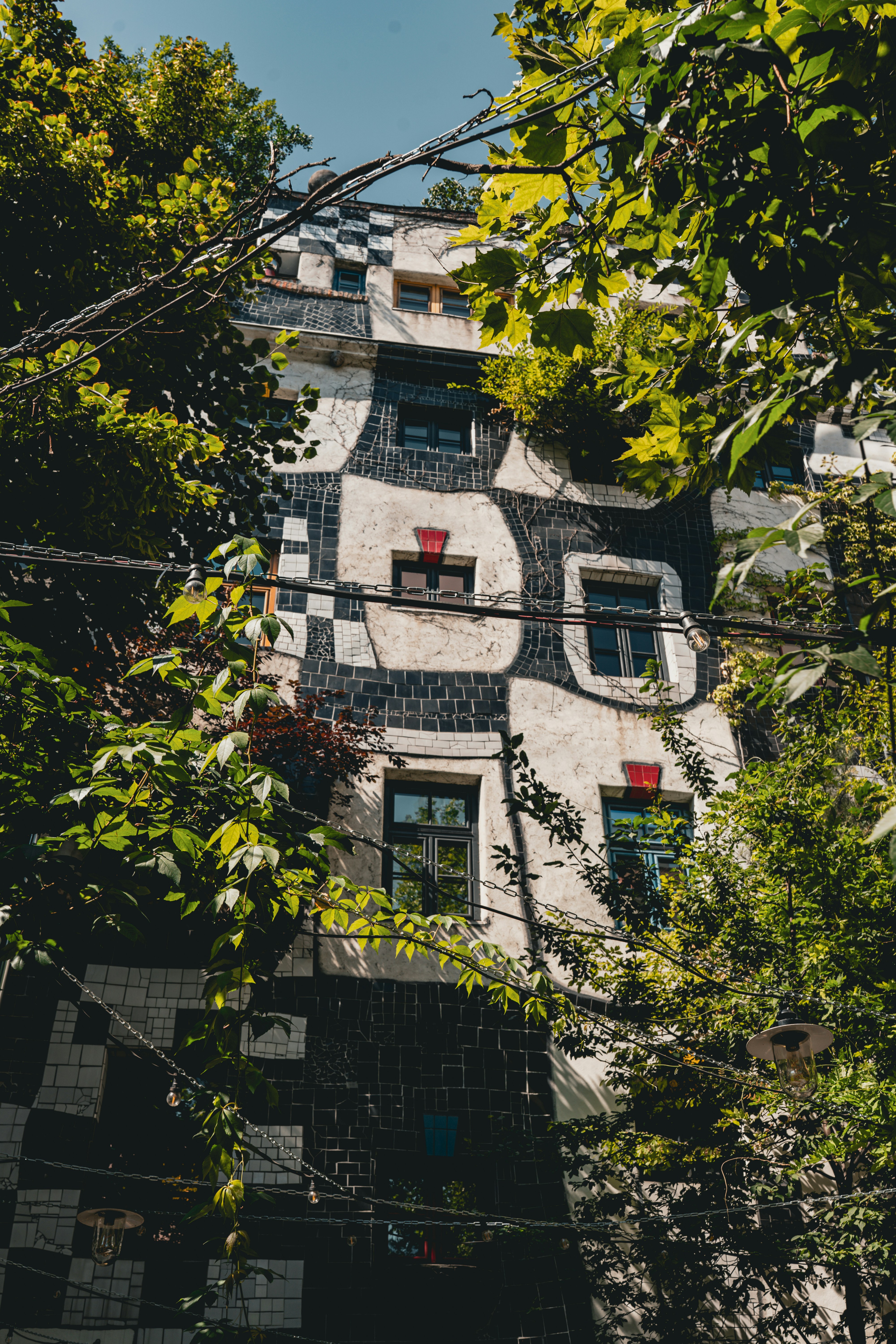 Unusual building facade covered in greenery