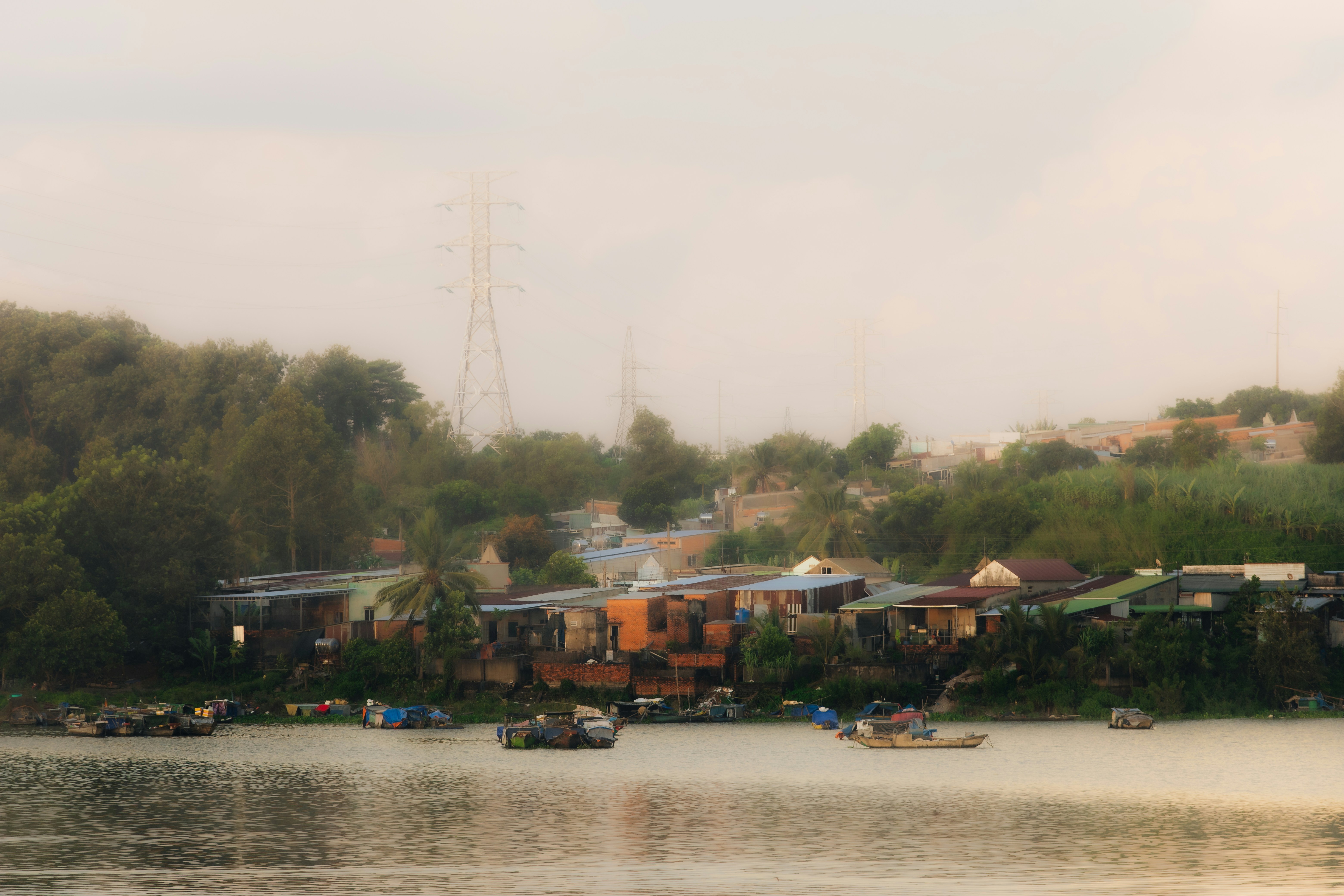 Small village on the riverbank with boats