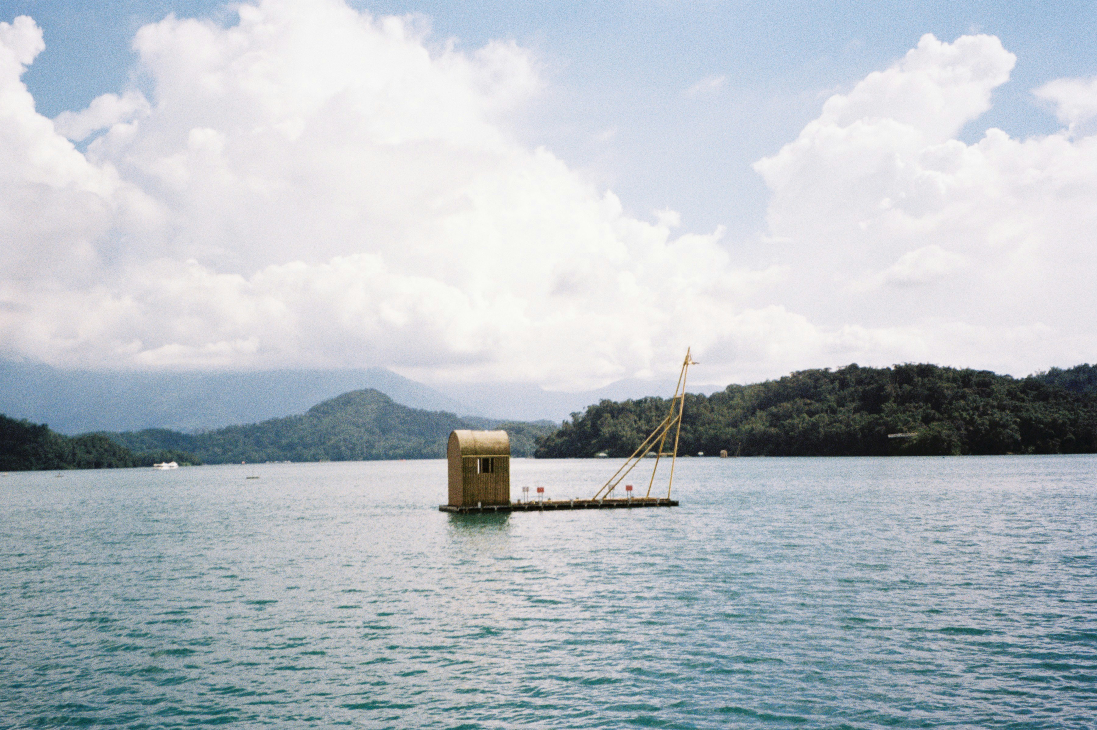 Golden structure on a raft in a lake photo – Free Summer Image on Unsplash