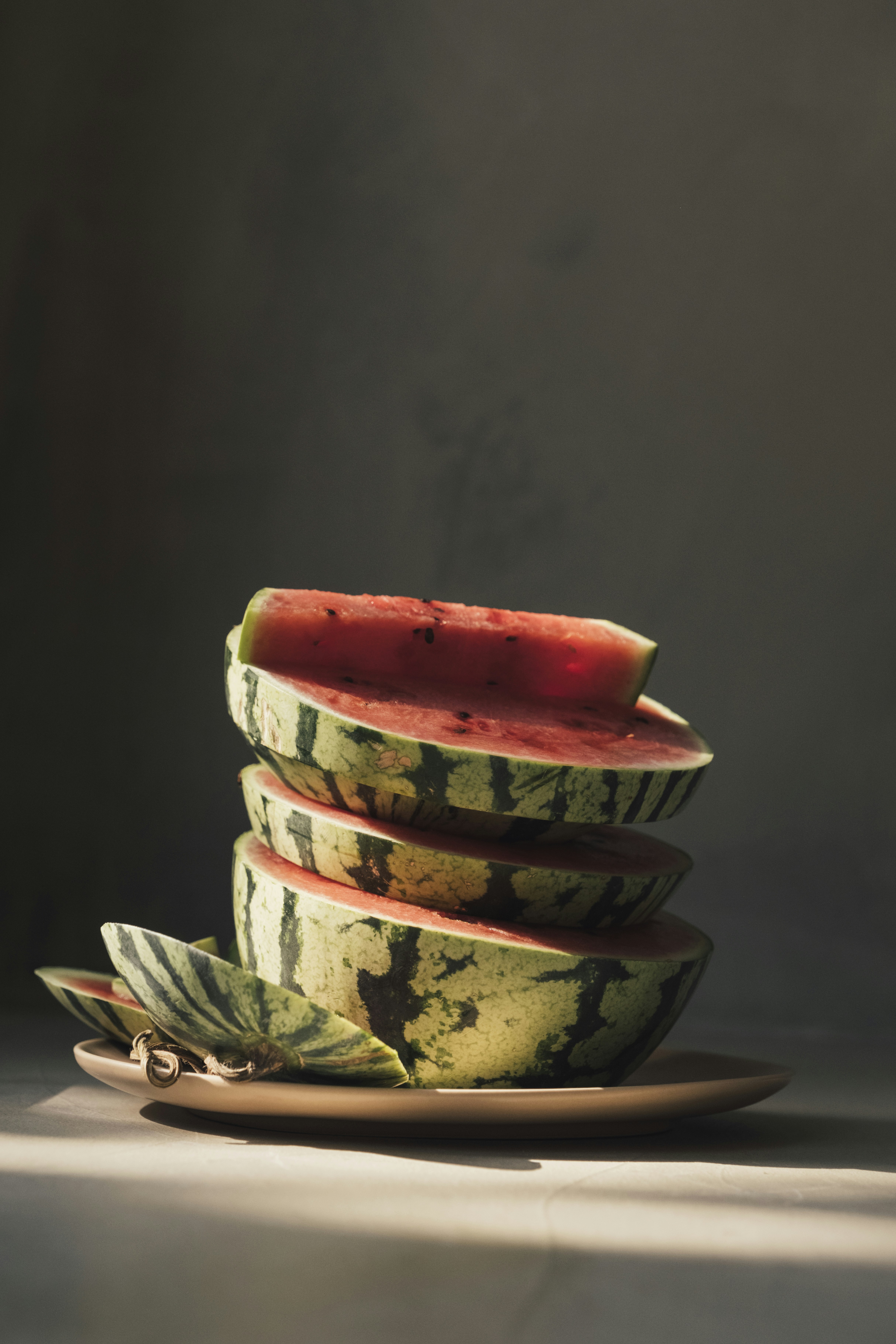 Stack of sliced watermelons on a plate