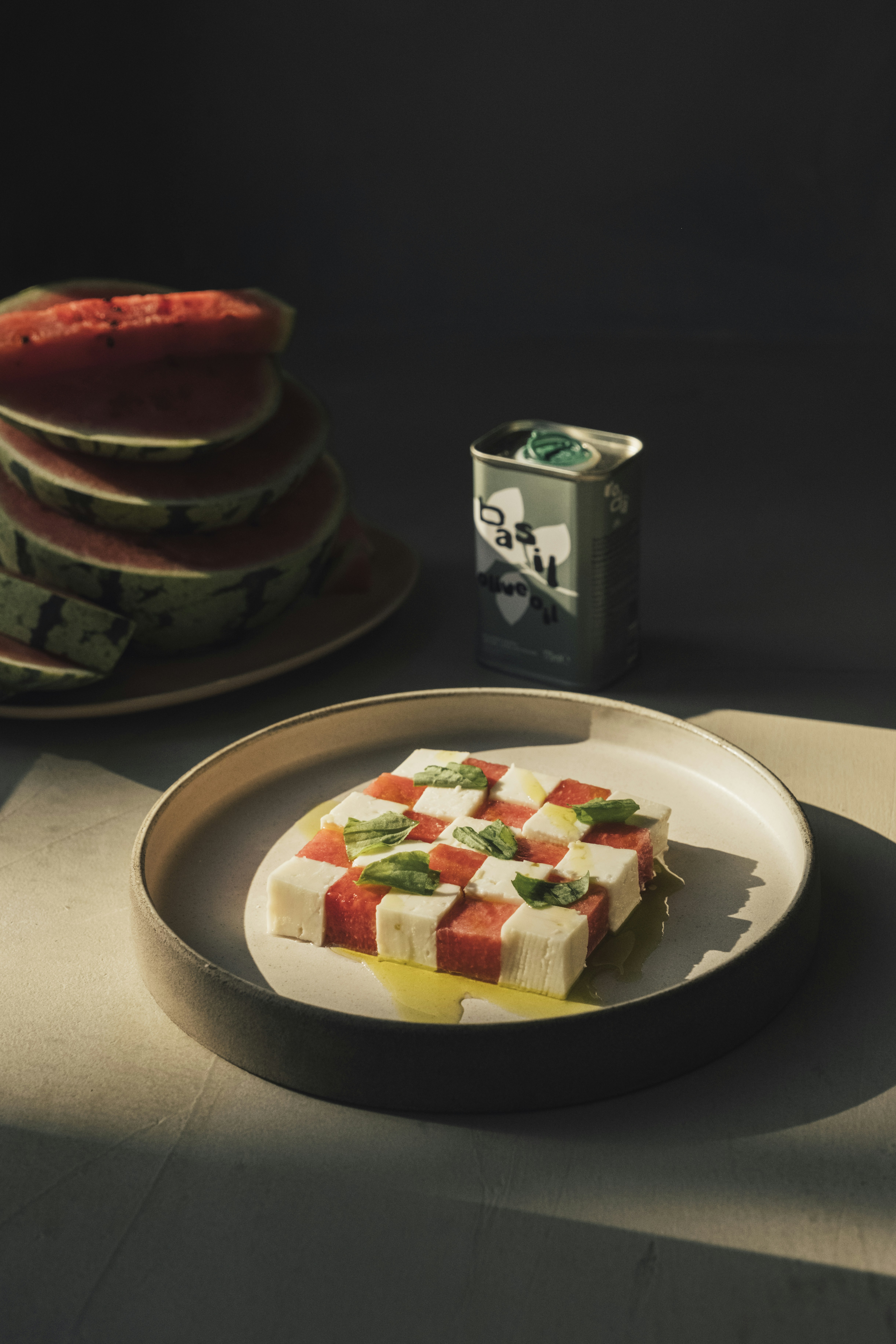 Checkerboard Tofu on a Round Plate: Mint Garnish under Soft Studio Light