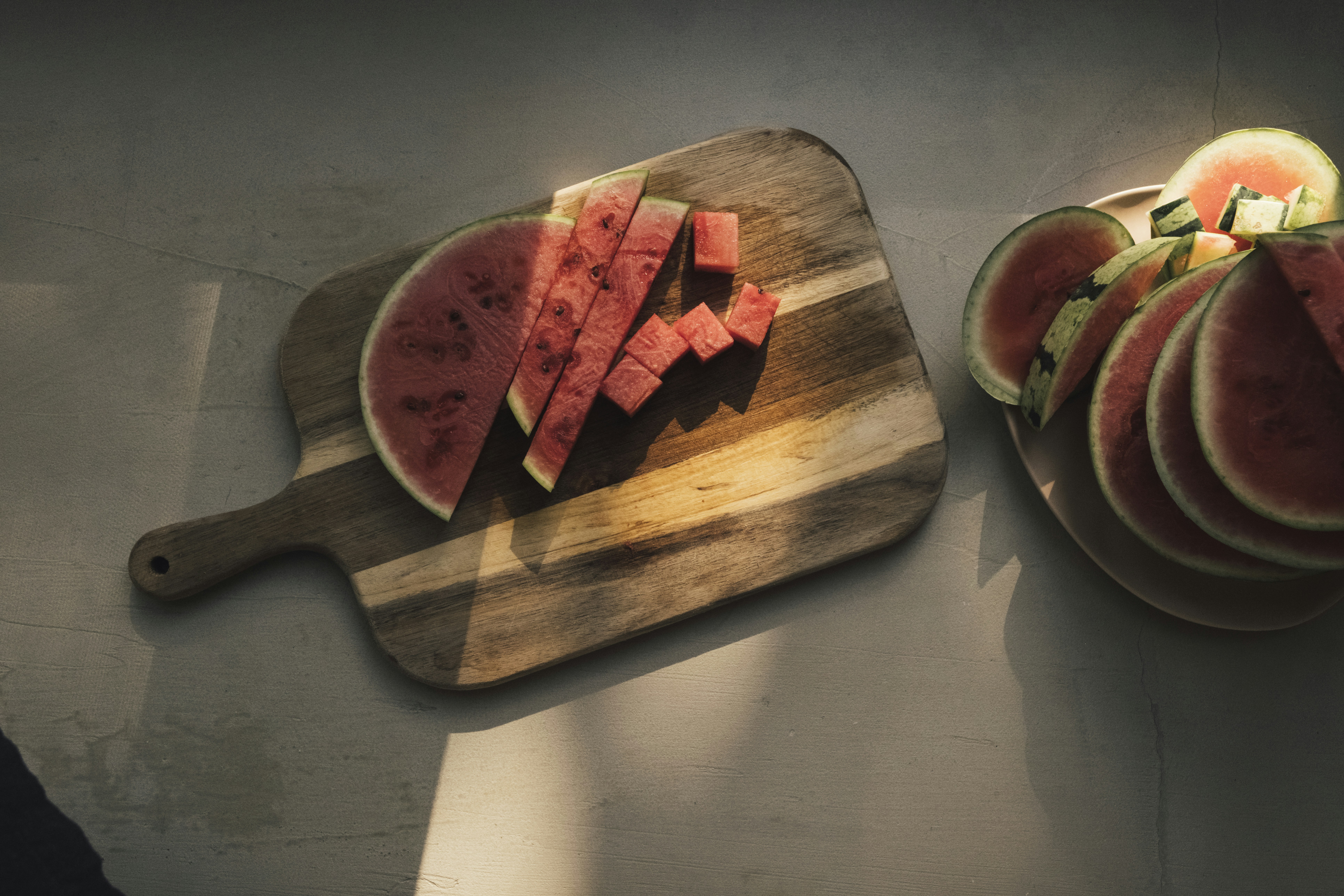Watermelon Board: Slices and Rounds on a Sunlit Counter