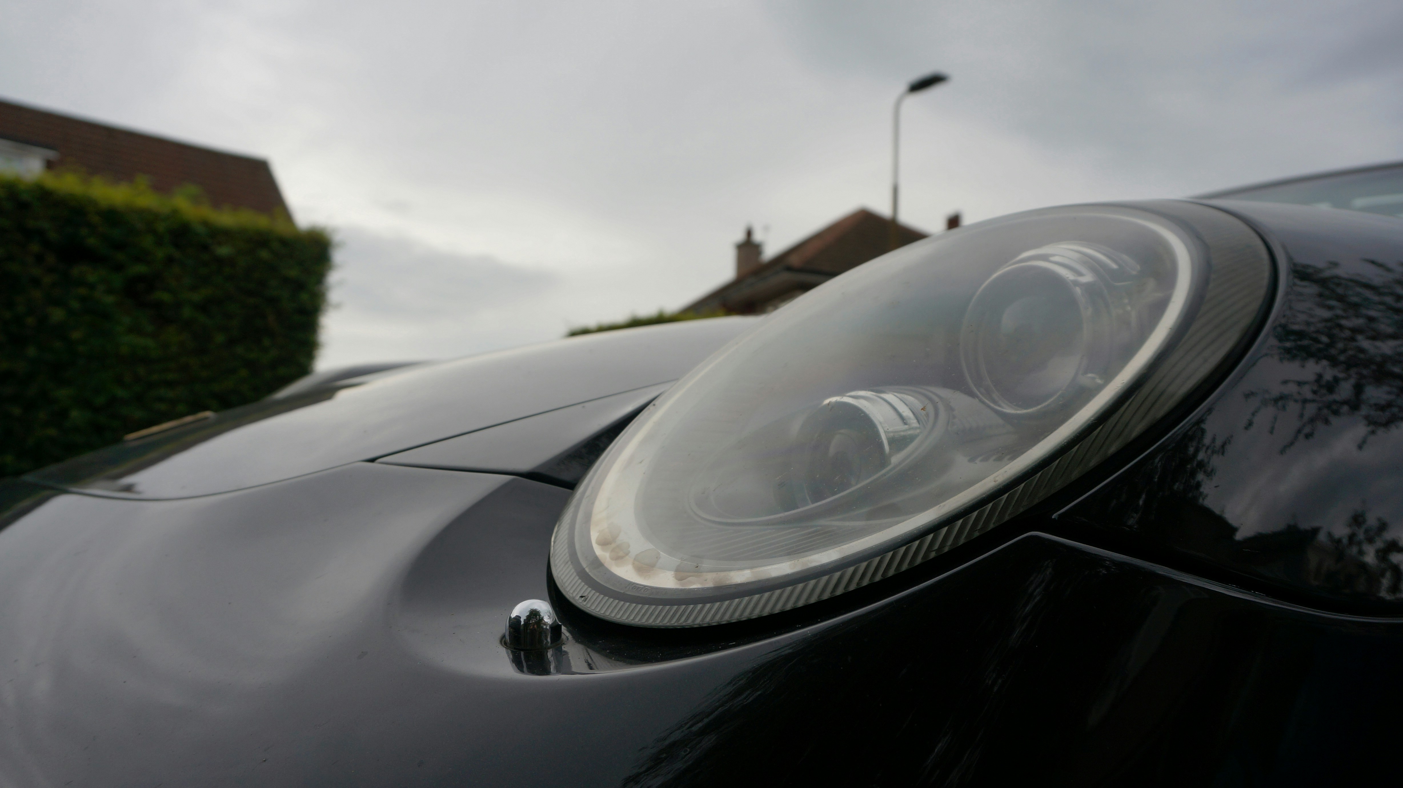 Close-up of a black car's headlight