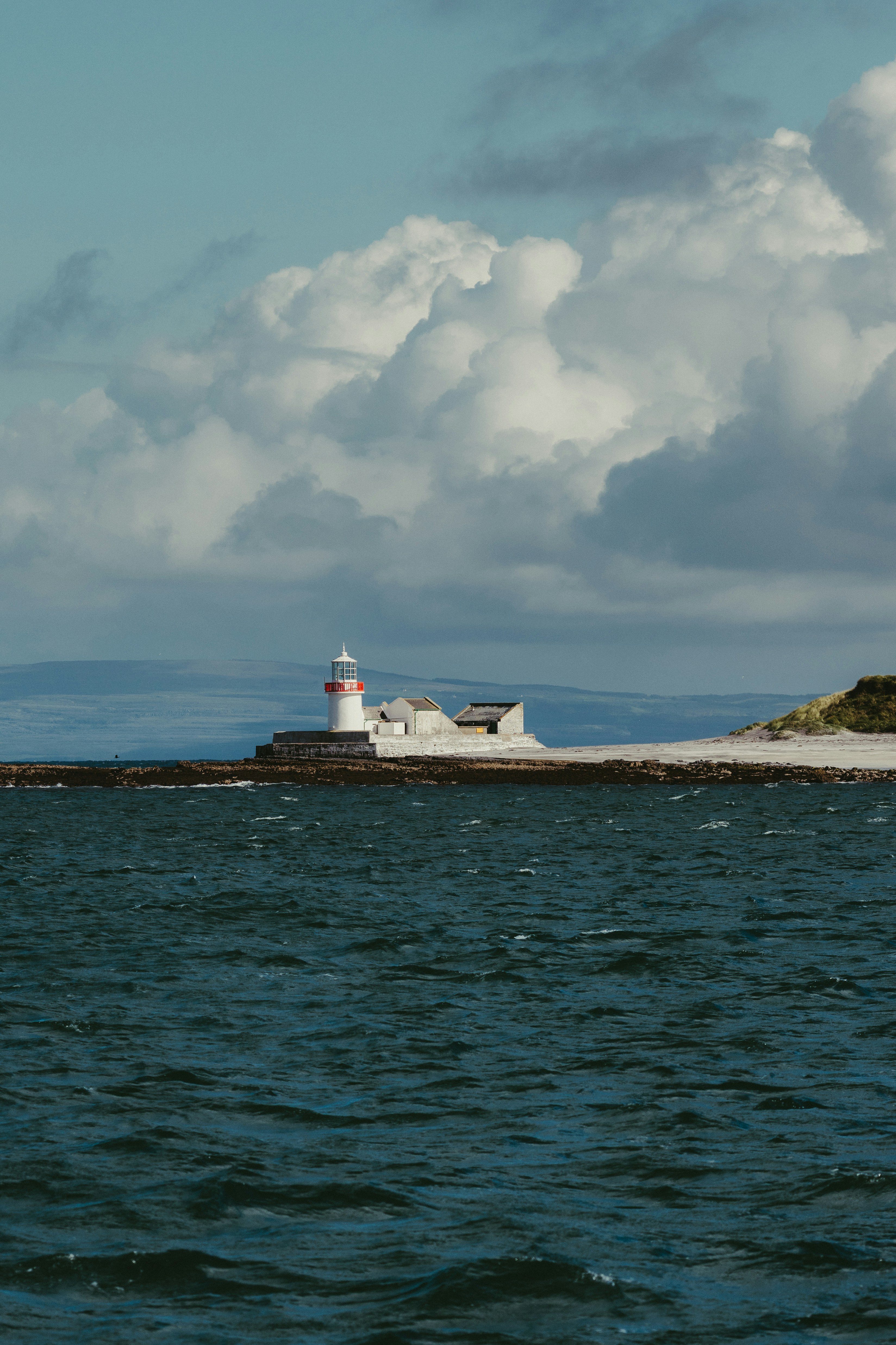 Beacon of Solitude: The Lighthouse by the Sea