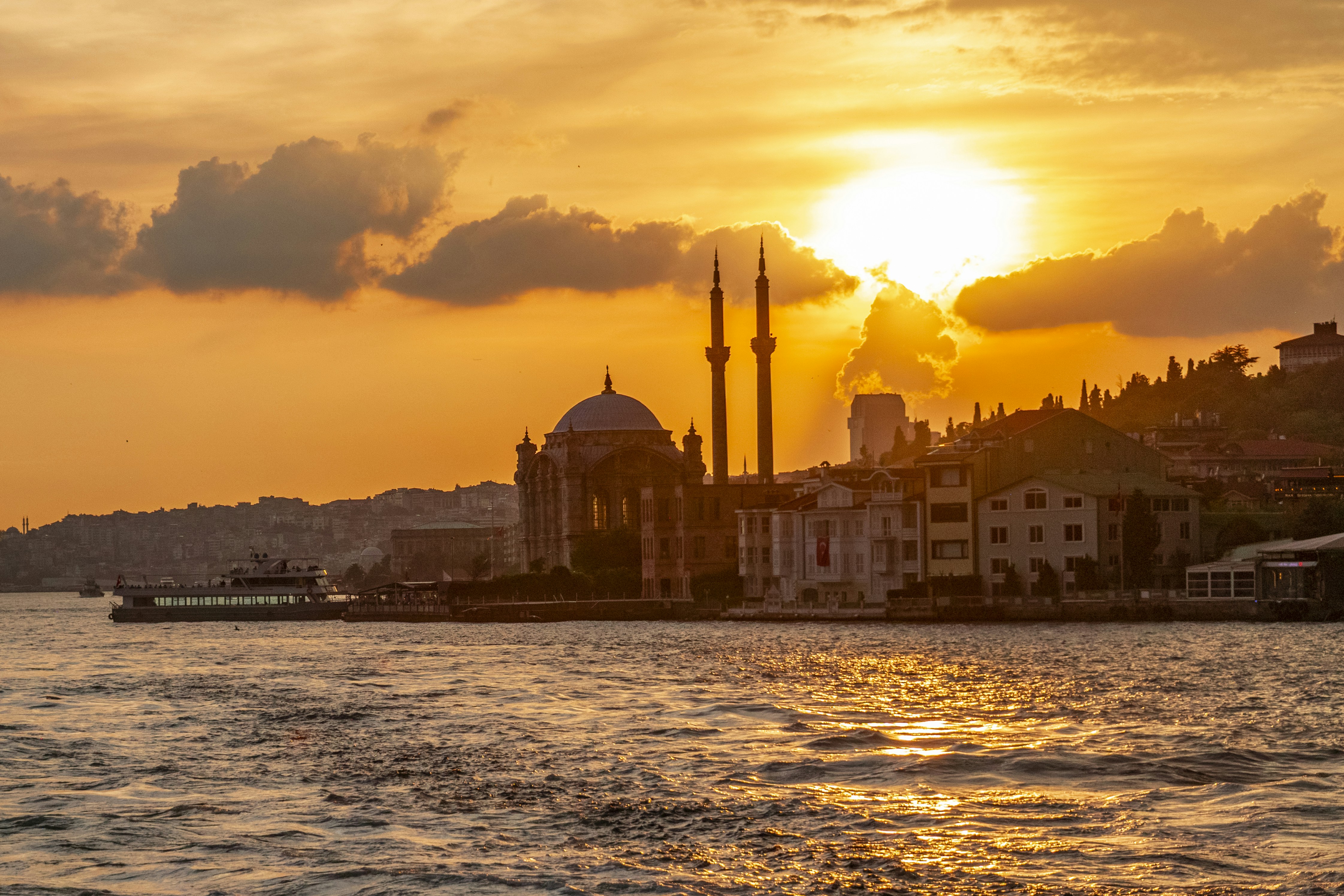 Sunset on the Bosphorus | Mosque and cityscape on the water at sunset