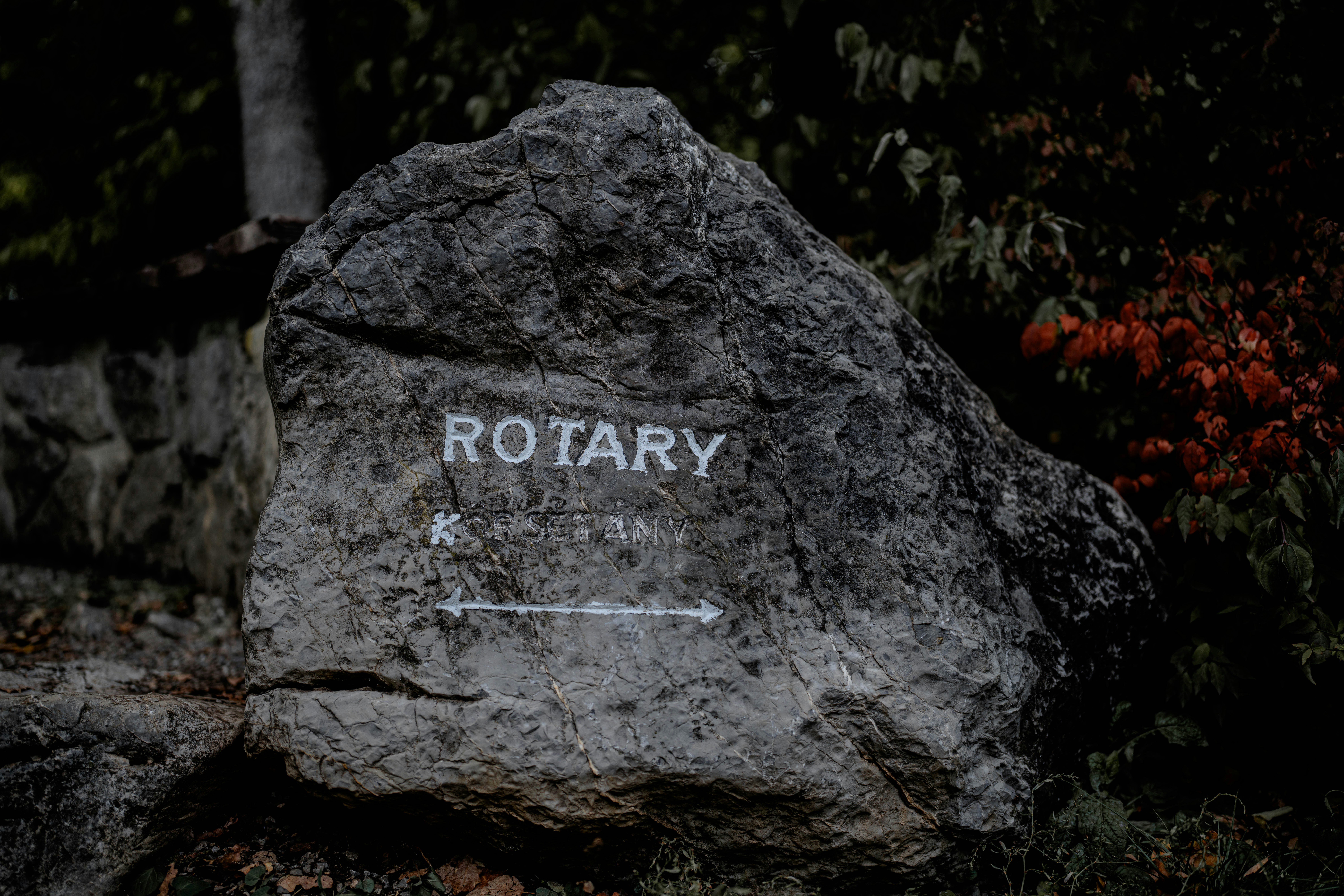 A large rock with the word rotary carved into it.