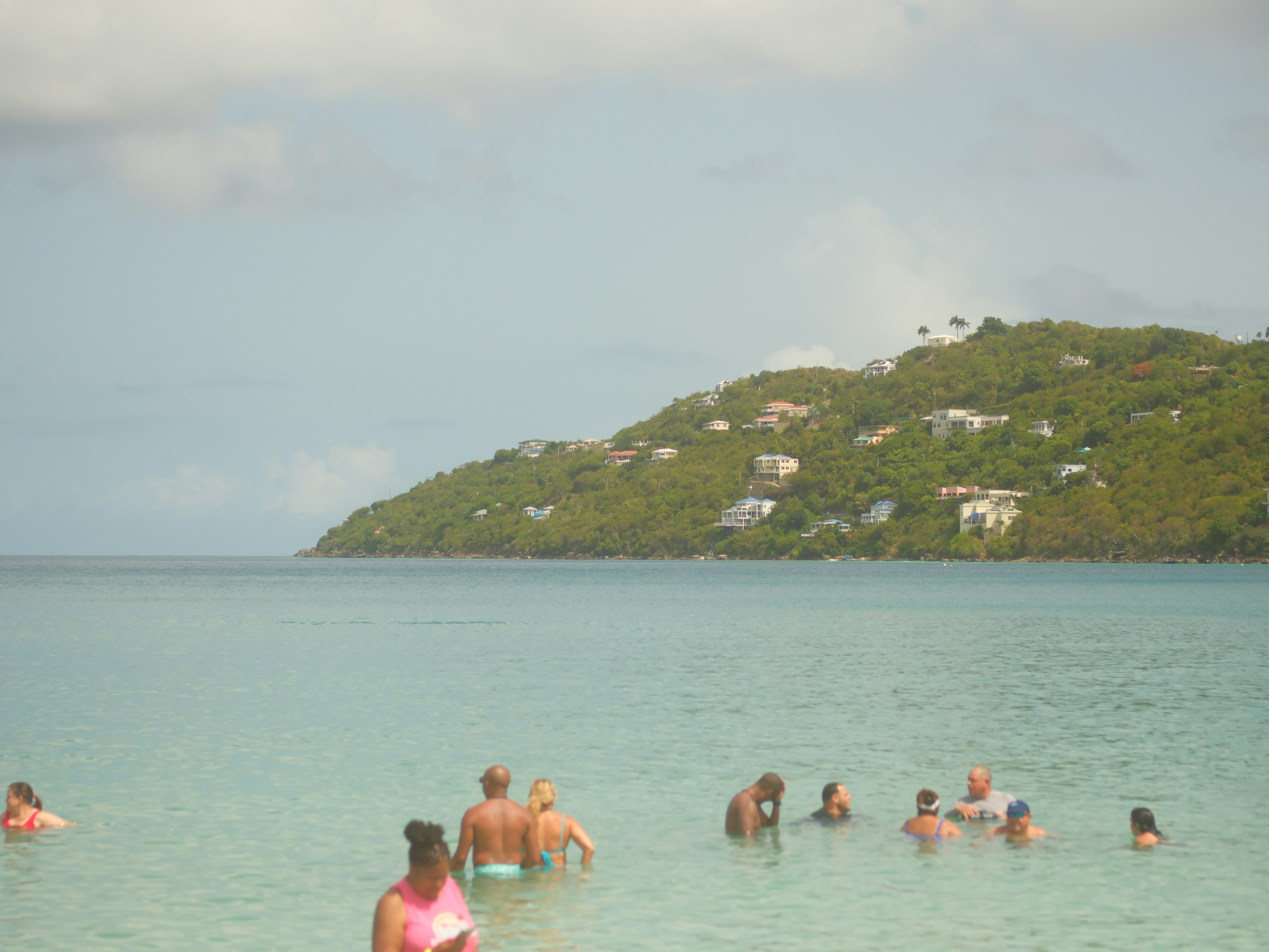 Shoreline Figures in Turquoise Waters