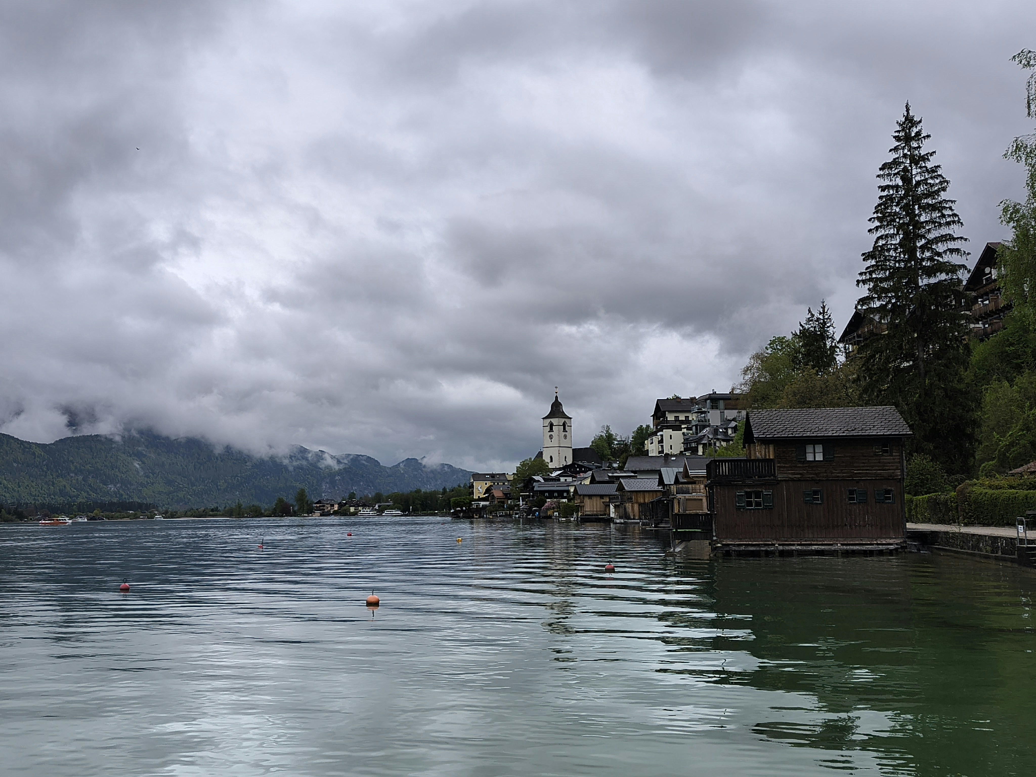 Town on a lake with cloudy skies