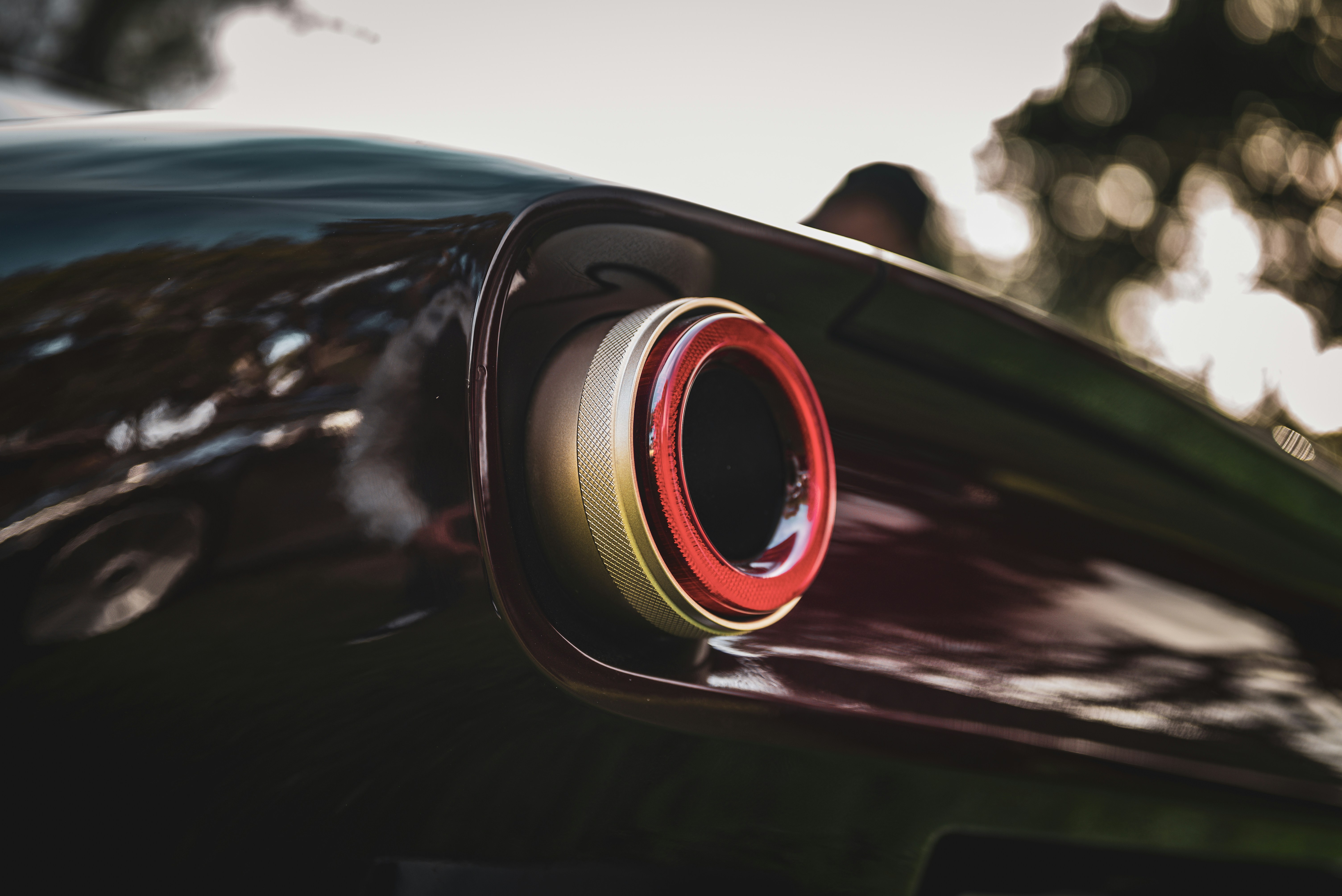 Crimson Halo on a Midnight Green Coupe