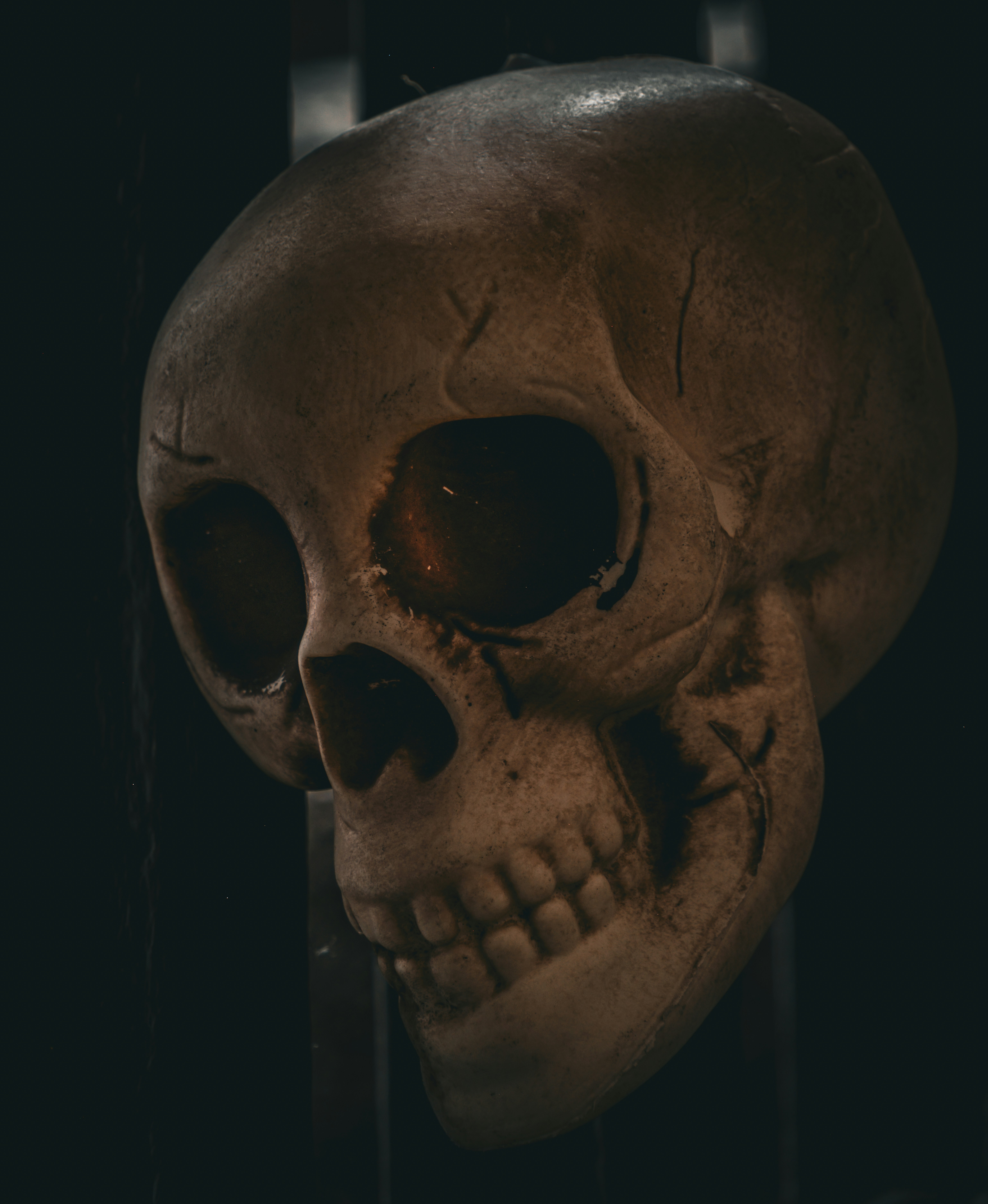 A creepy skull mask with dark eye sockets.