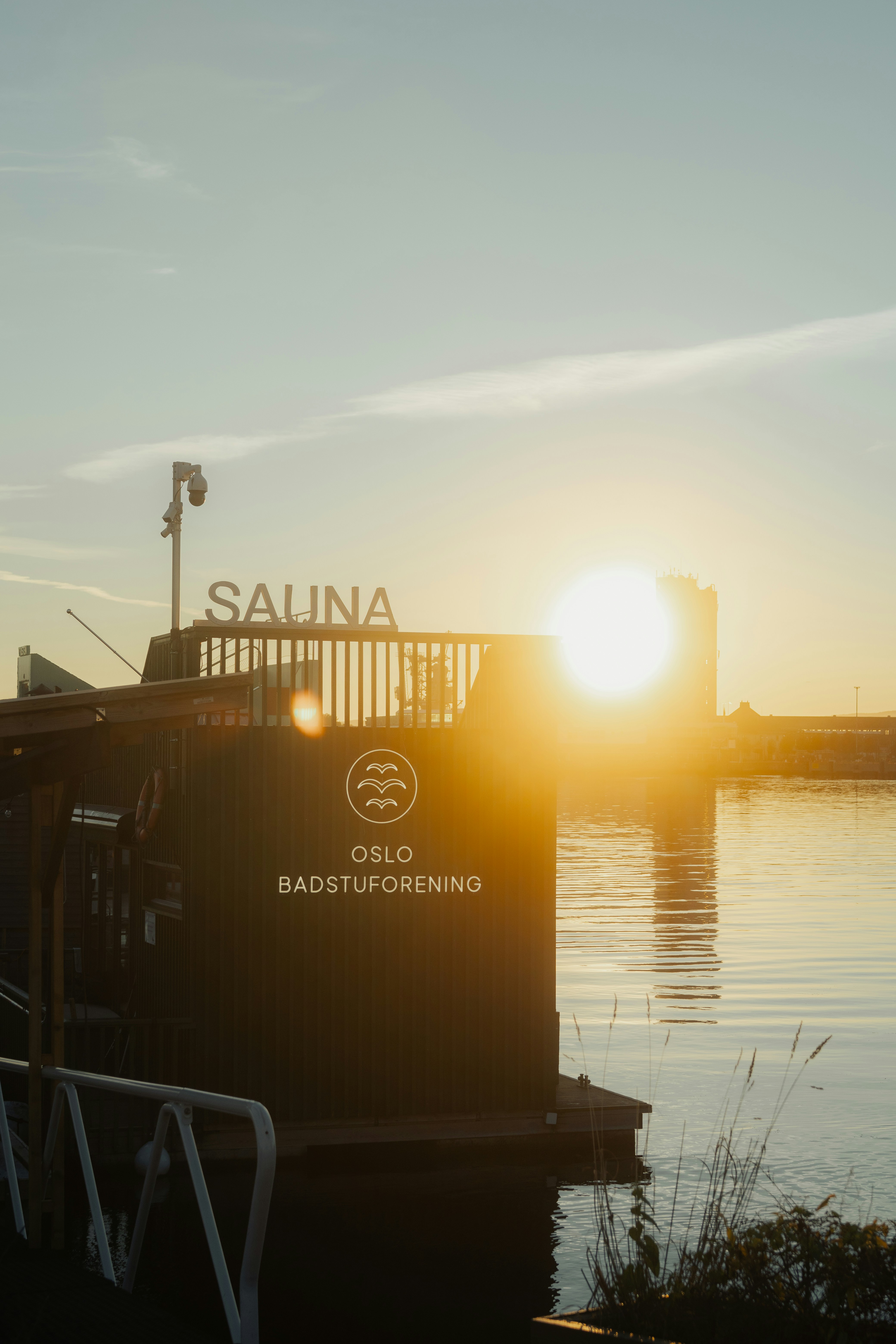 Golden Reflections at Oslo's Floating Sauna