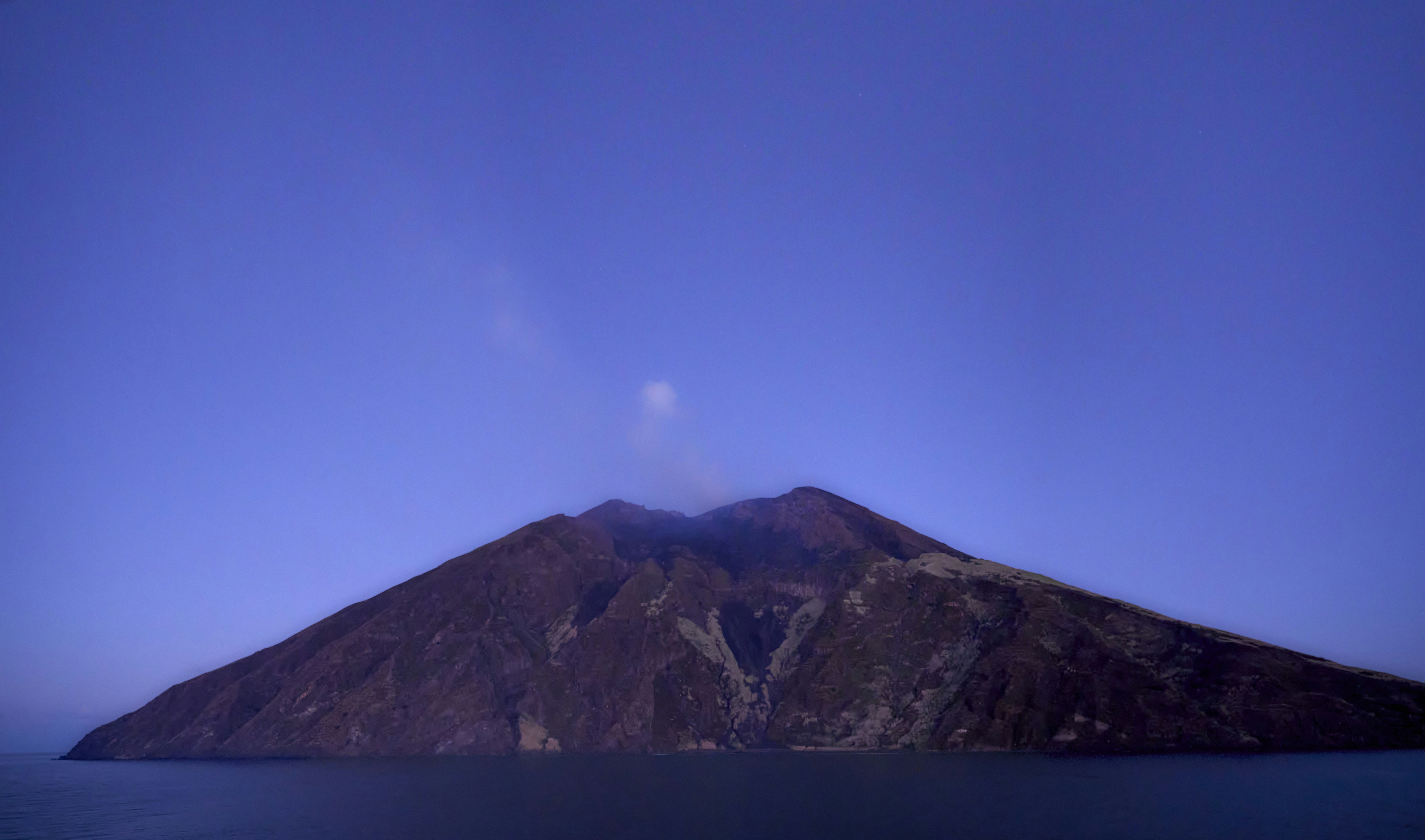 The Silent Sentinel: A Volcanic Island at Dusk
