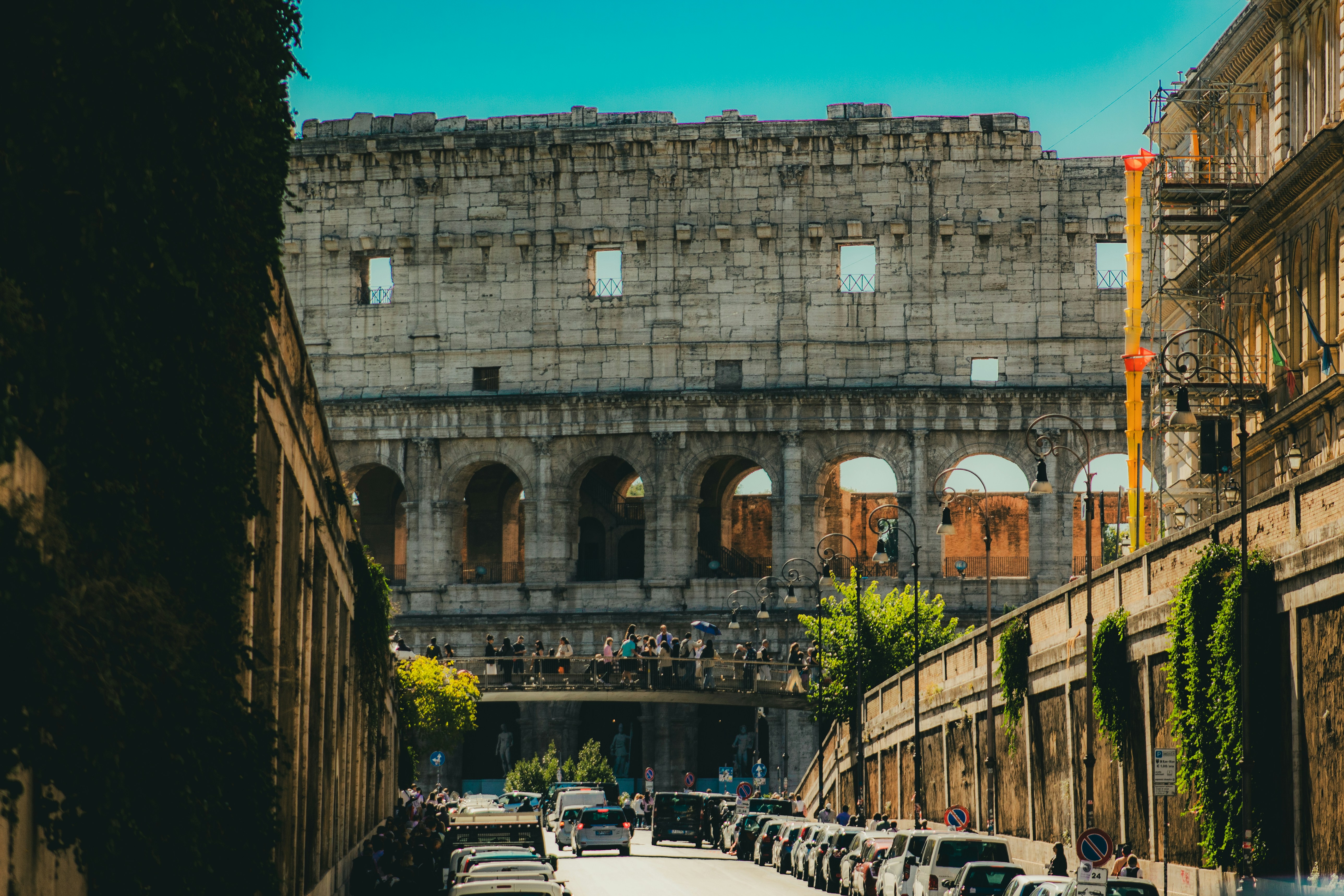 The colosseum in rome viewed from a street.