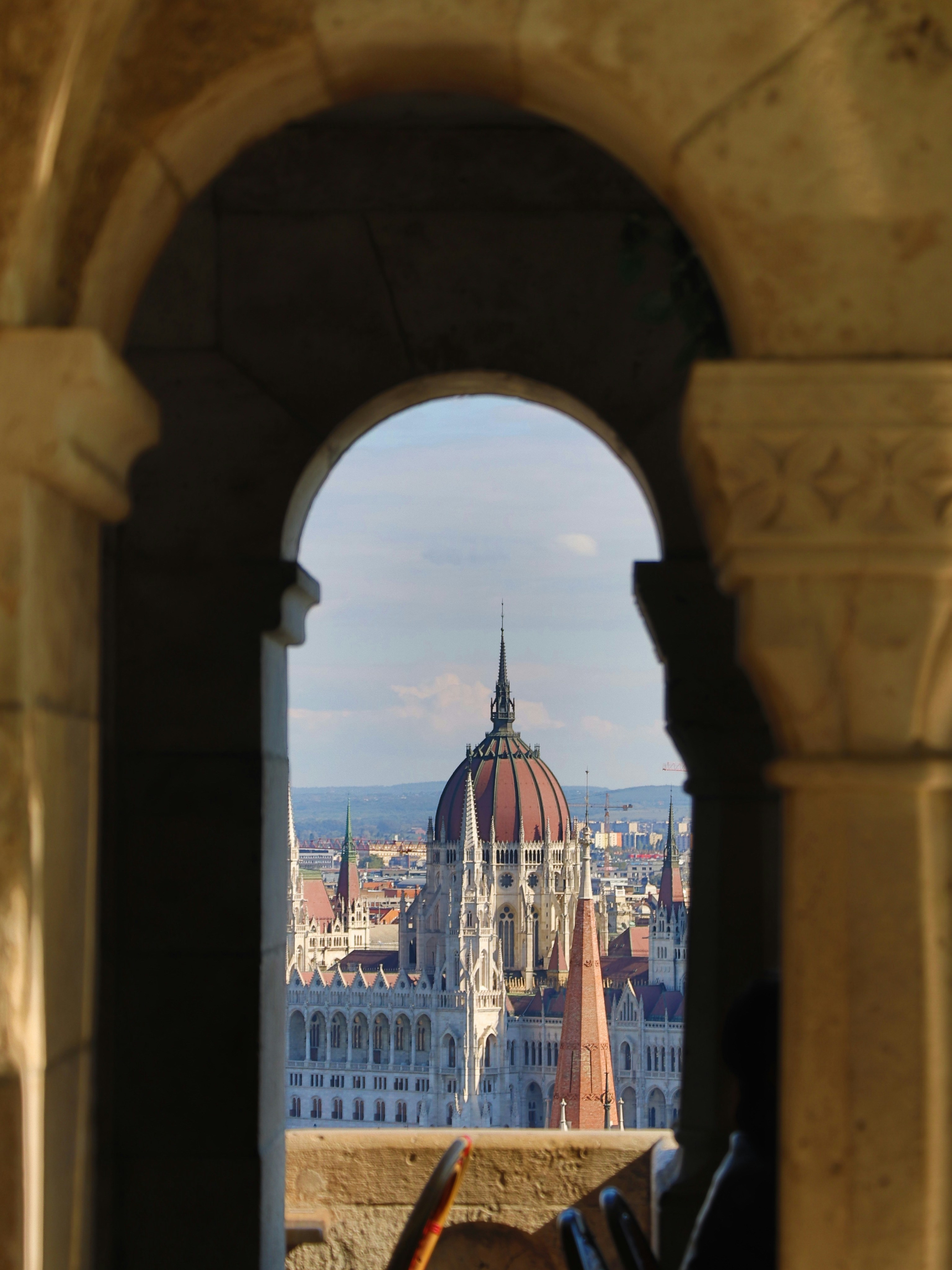 View of parliament building through stone archway