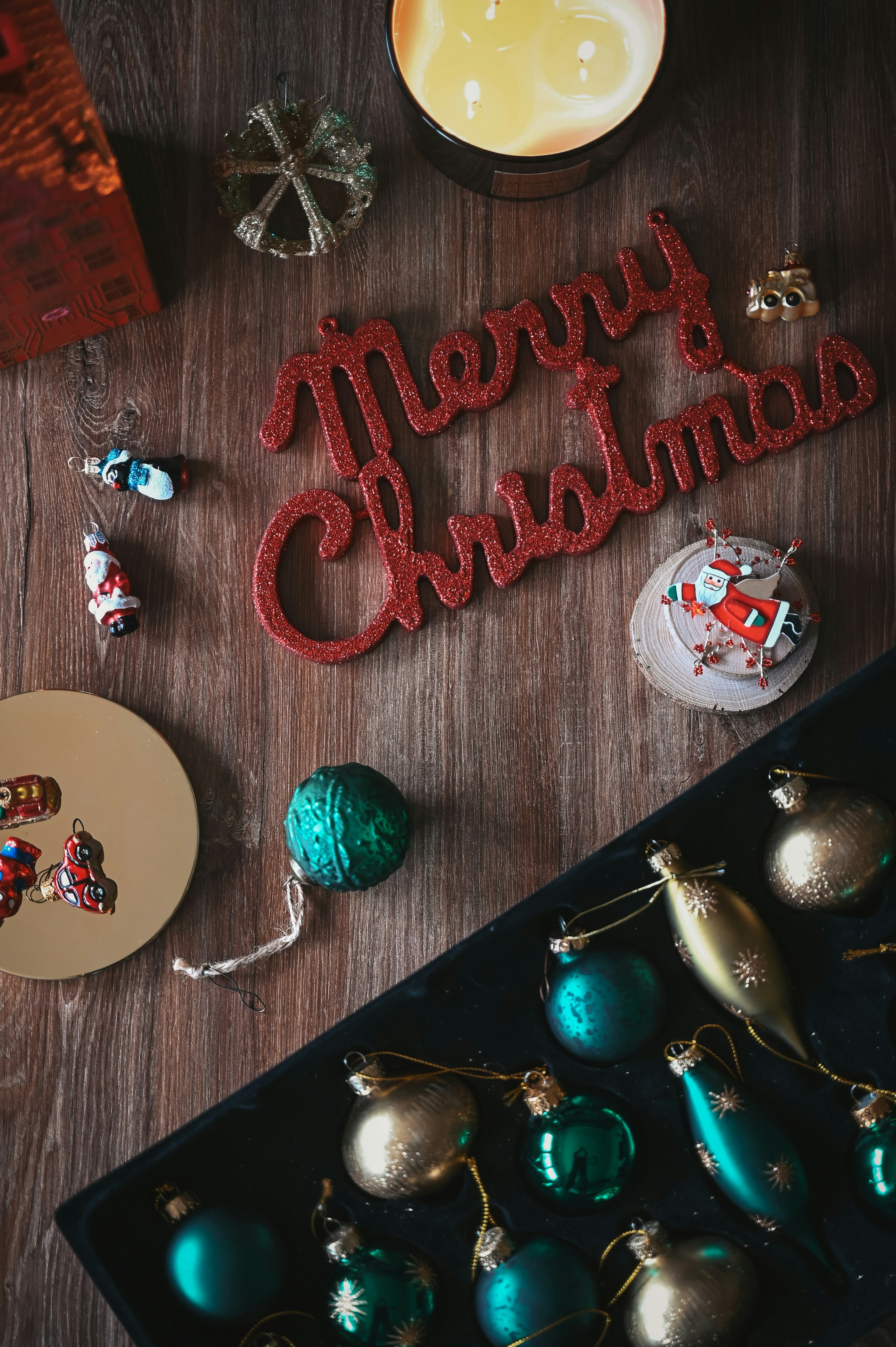 Glittering Cheer: The 'Merry Christmas' Sign Anchors a Table of Vintage Ornaments