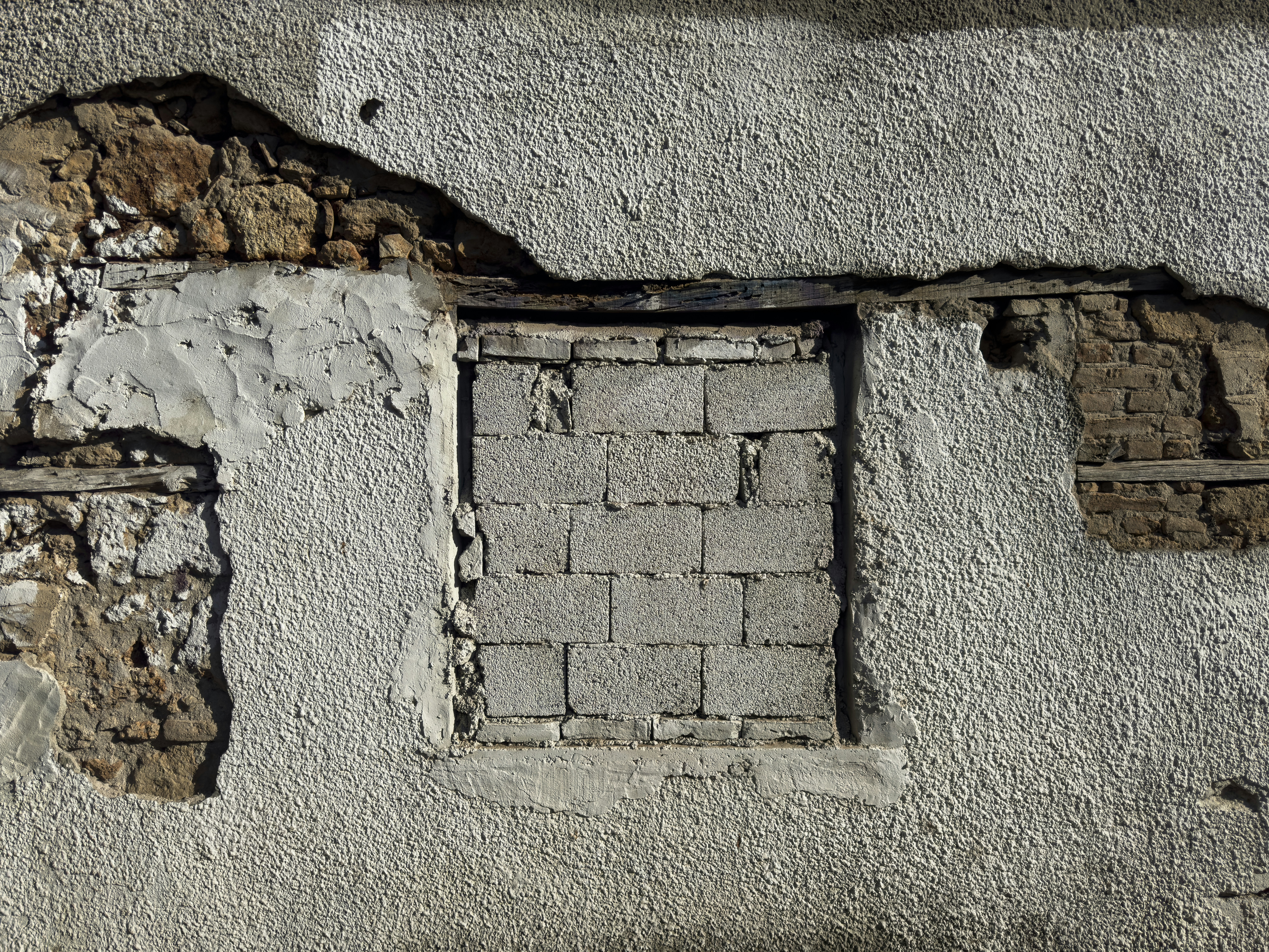 textured old house wall with cracks