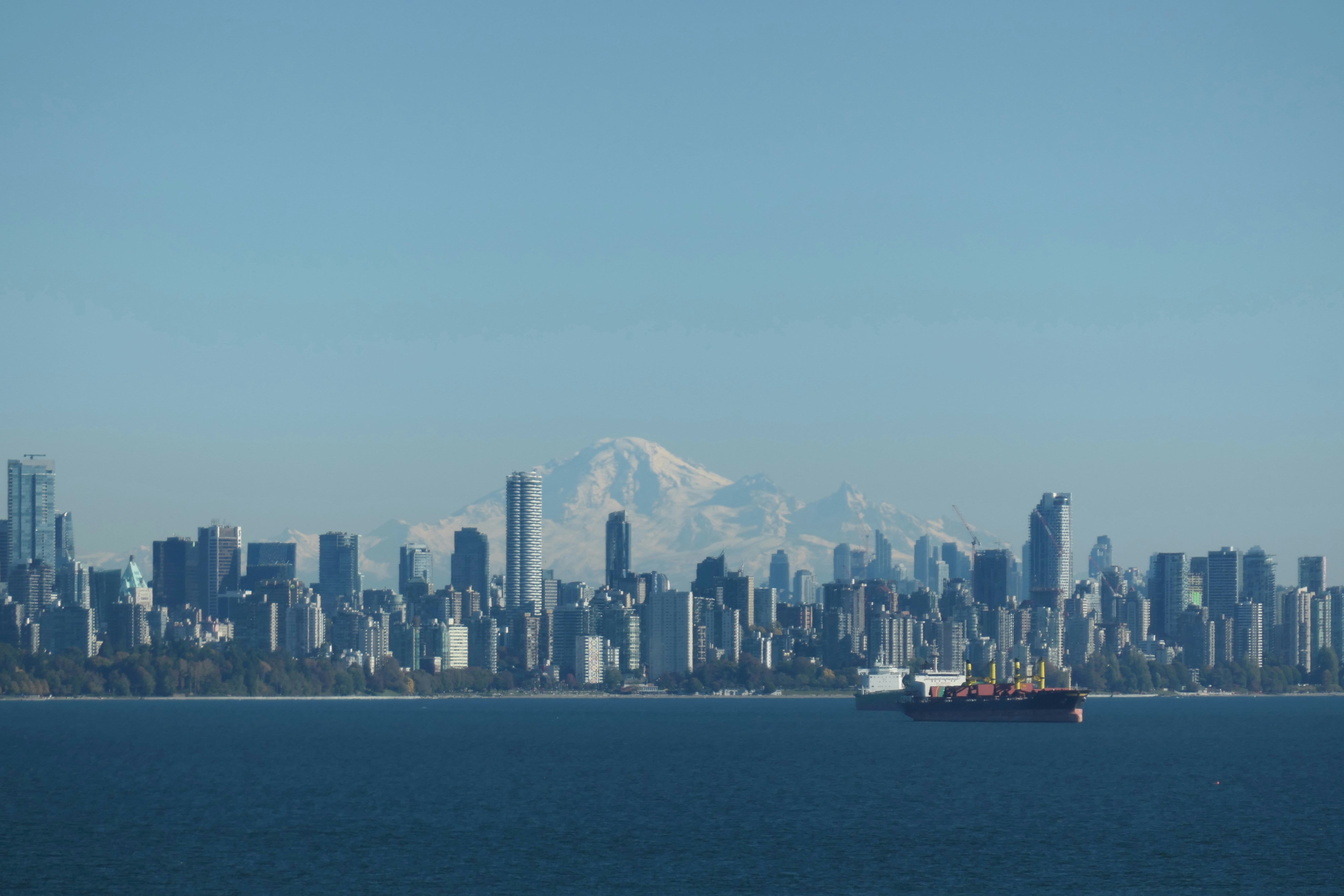 Van City from Lighthouse Park | City skyline with snow-capped mountains behind