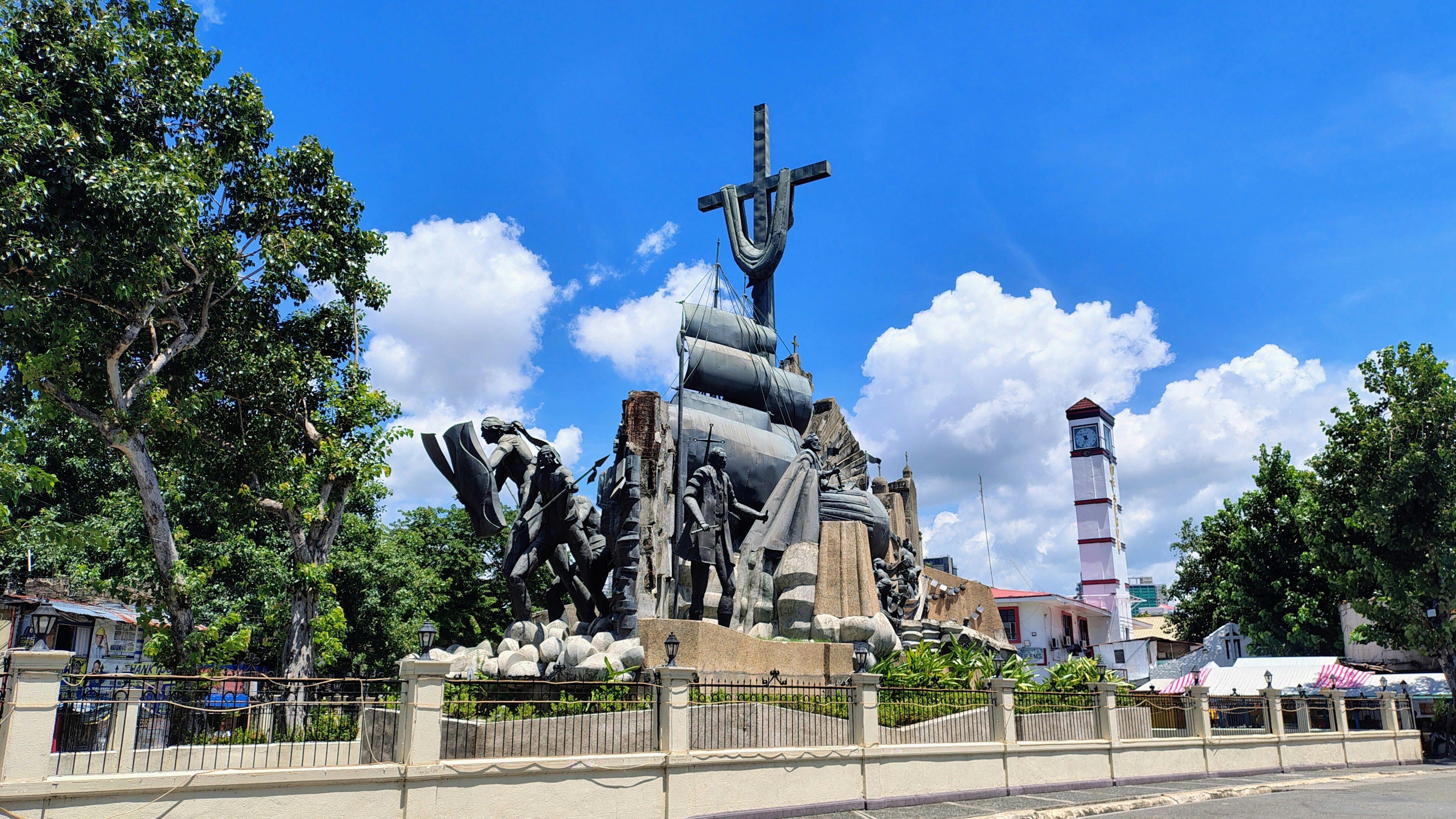 Heritage of Cebu Monument, Cebu, Philippines | Monument with ship and cross under blue sky