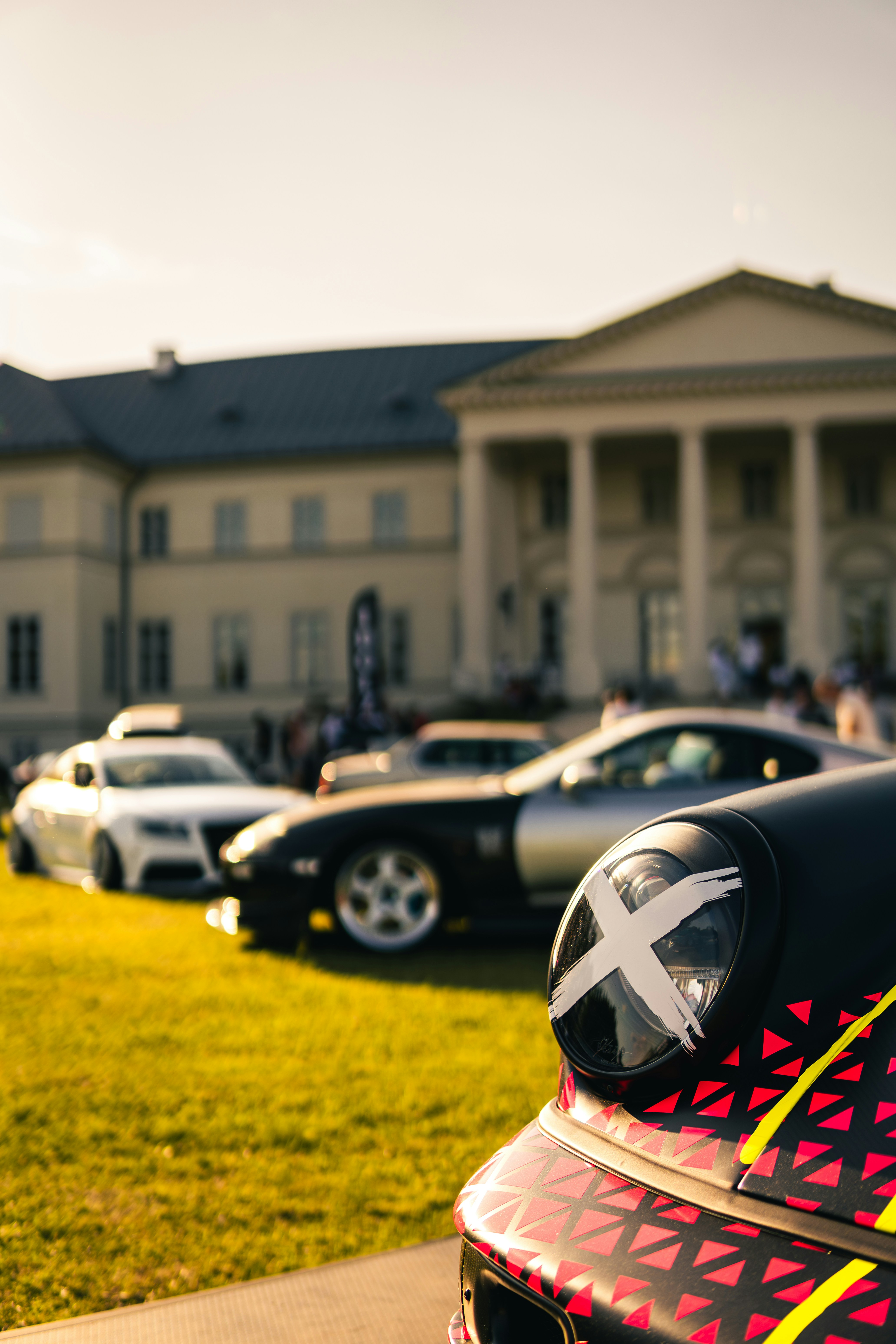 Sporting bold graphics at a stately estate car show